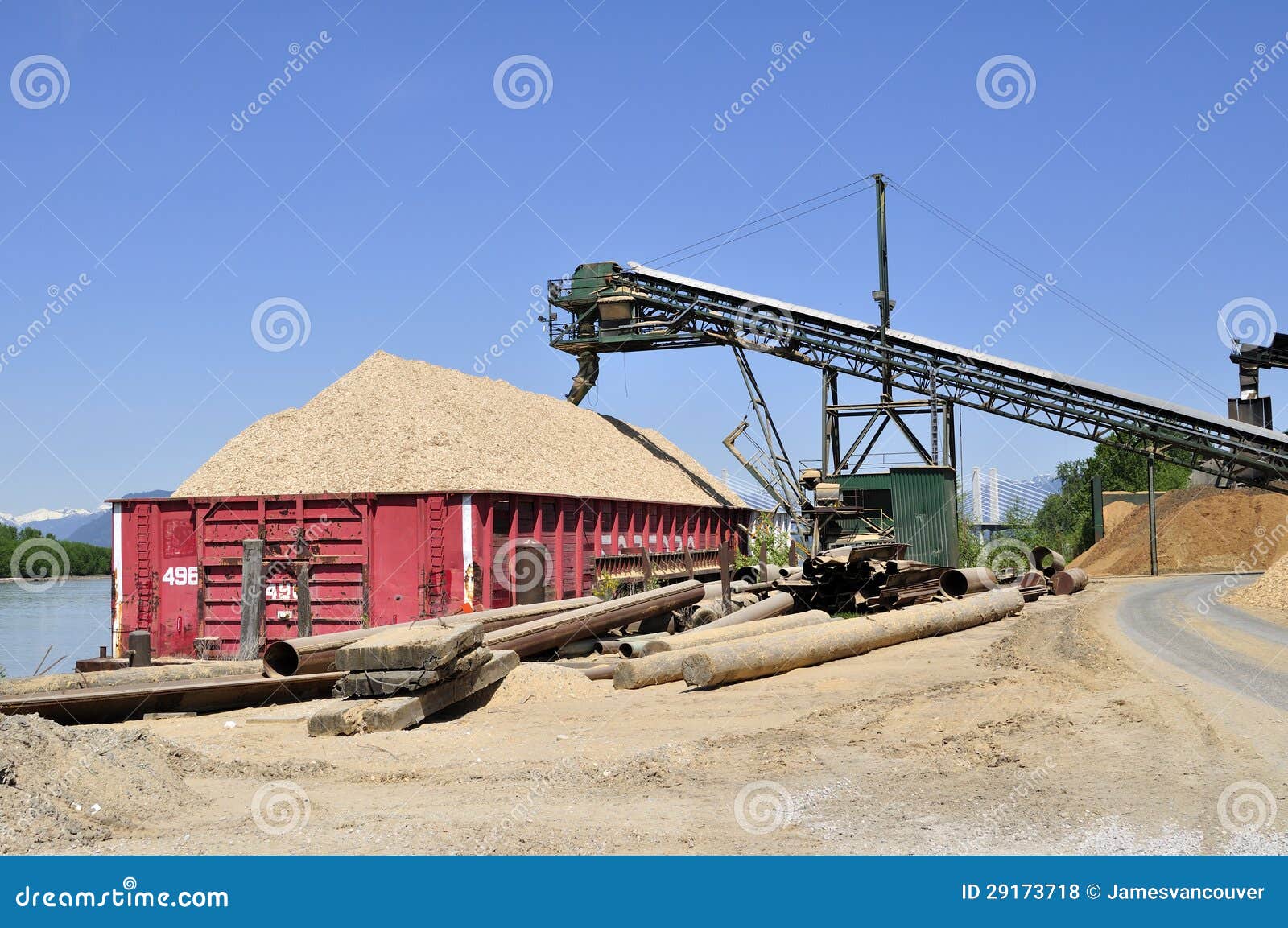 Conveyor Transporting Sawdust into a Vessel Stock Photo - Image of ...