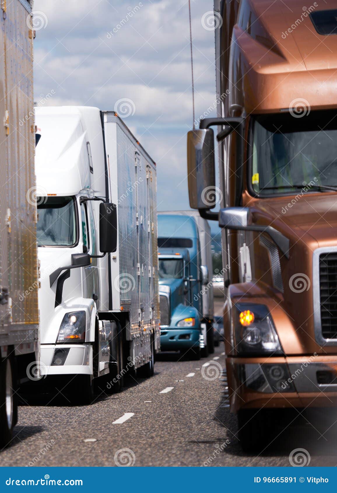 Convoy of Semi Trucks of Different Models and Colors Running on Stock ...