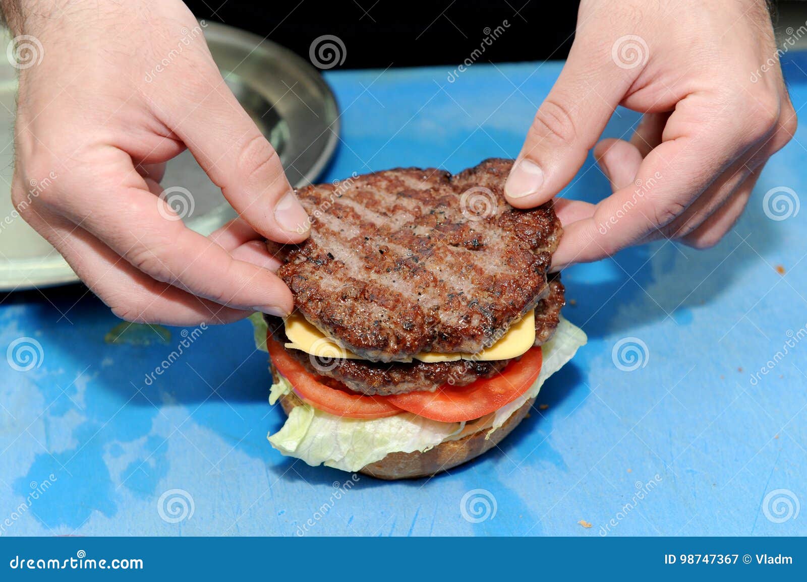 Cook Adding Burger on Prepared Buns for Hamburger. Preparing and Making ...