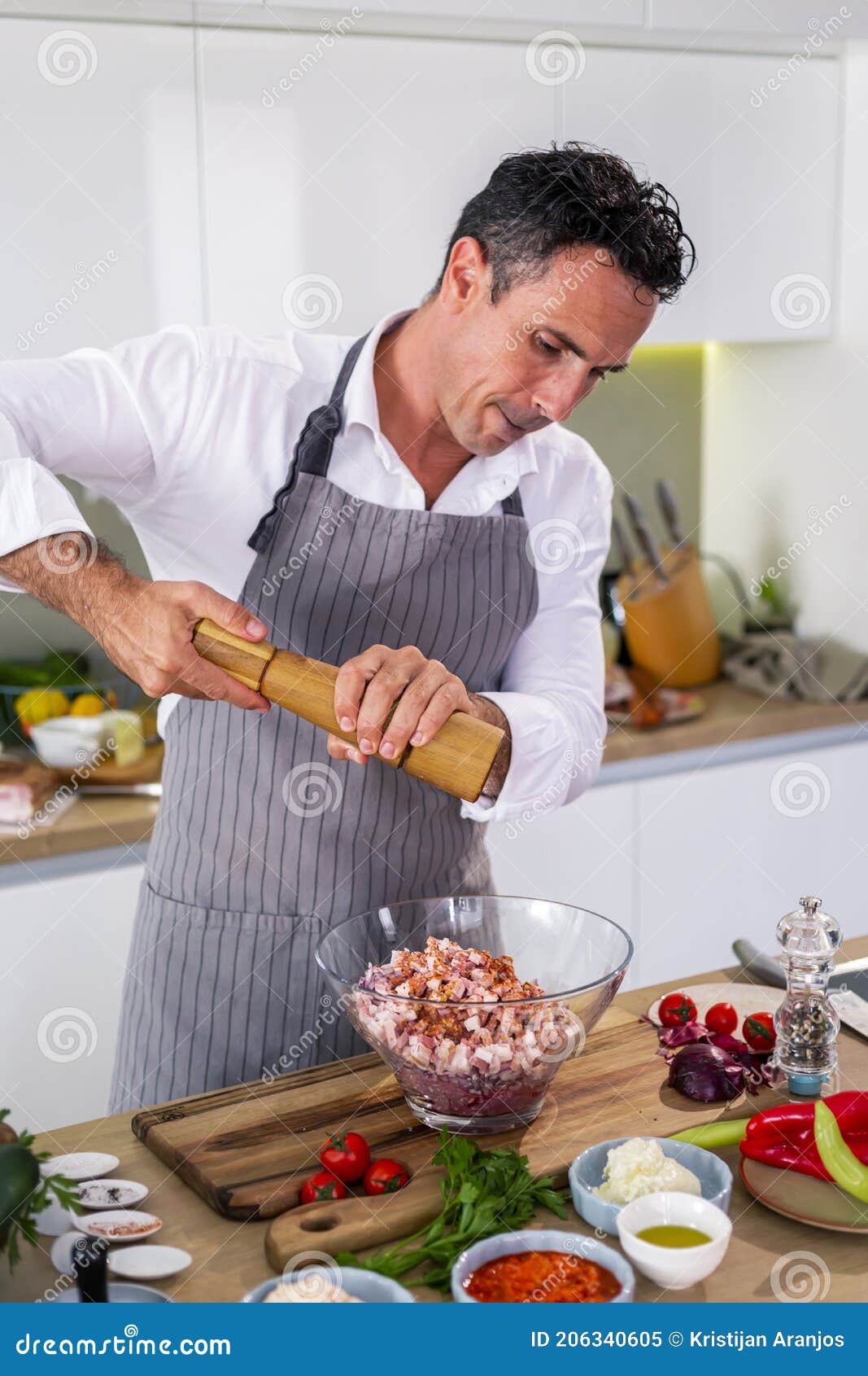 The Cook Adding the Spices in a Bowl with the Meat, Onion and Bacon ...