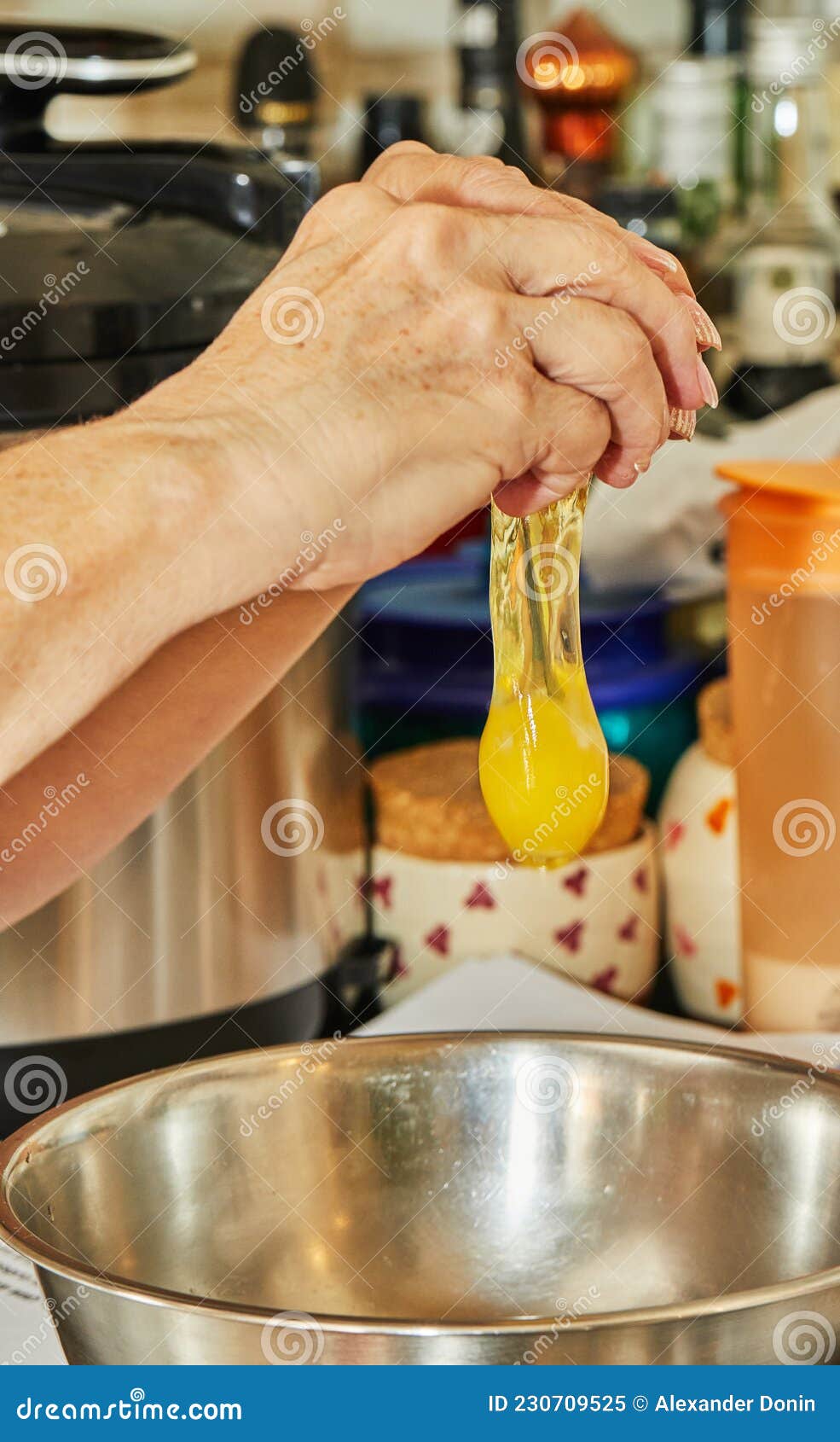 Cook Adds an Egg To the Bowl of Ingredients To Prepare the Dish Stock ...