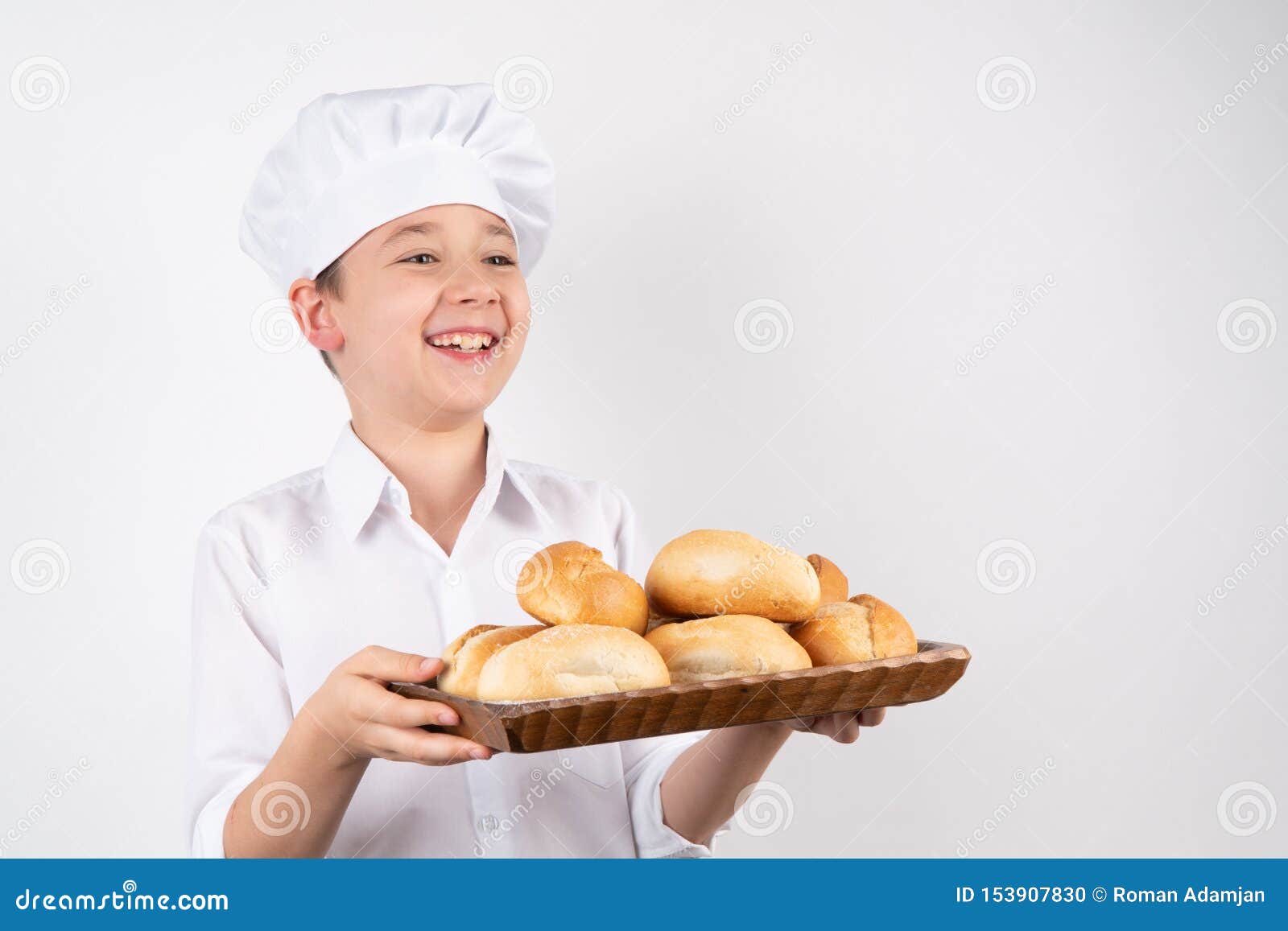 Cook Boy with Bread on White Background, Laughs Stock Photo - Image of ...