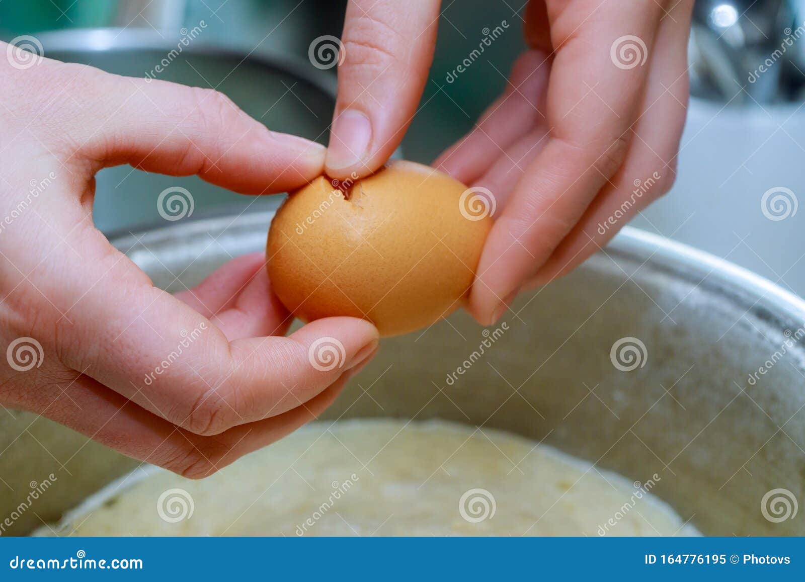 Cook Breaking an Egg into the Bowl in a Bakery Stock Image - Image of ...
