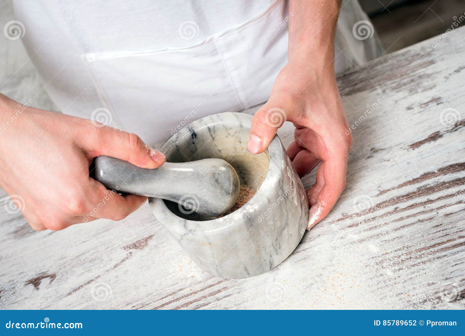Cook chef with a mortar stock photo. Image of cuisine - 85789652