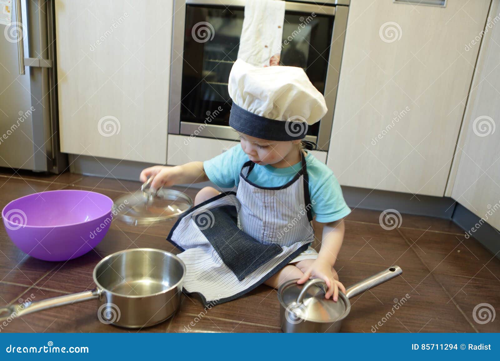 Cook child on floor stock photo. Image of male, kitchen - 85711294