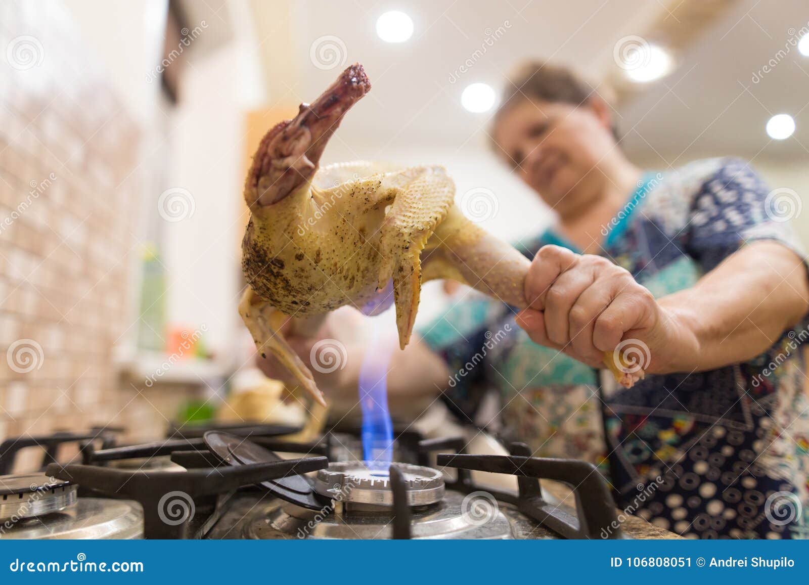 The Cook Cuts the Chicken on Fire Stock Image - Image of yellow, grill ...