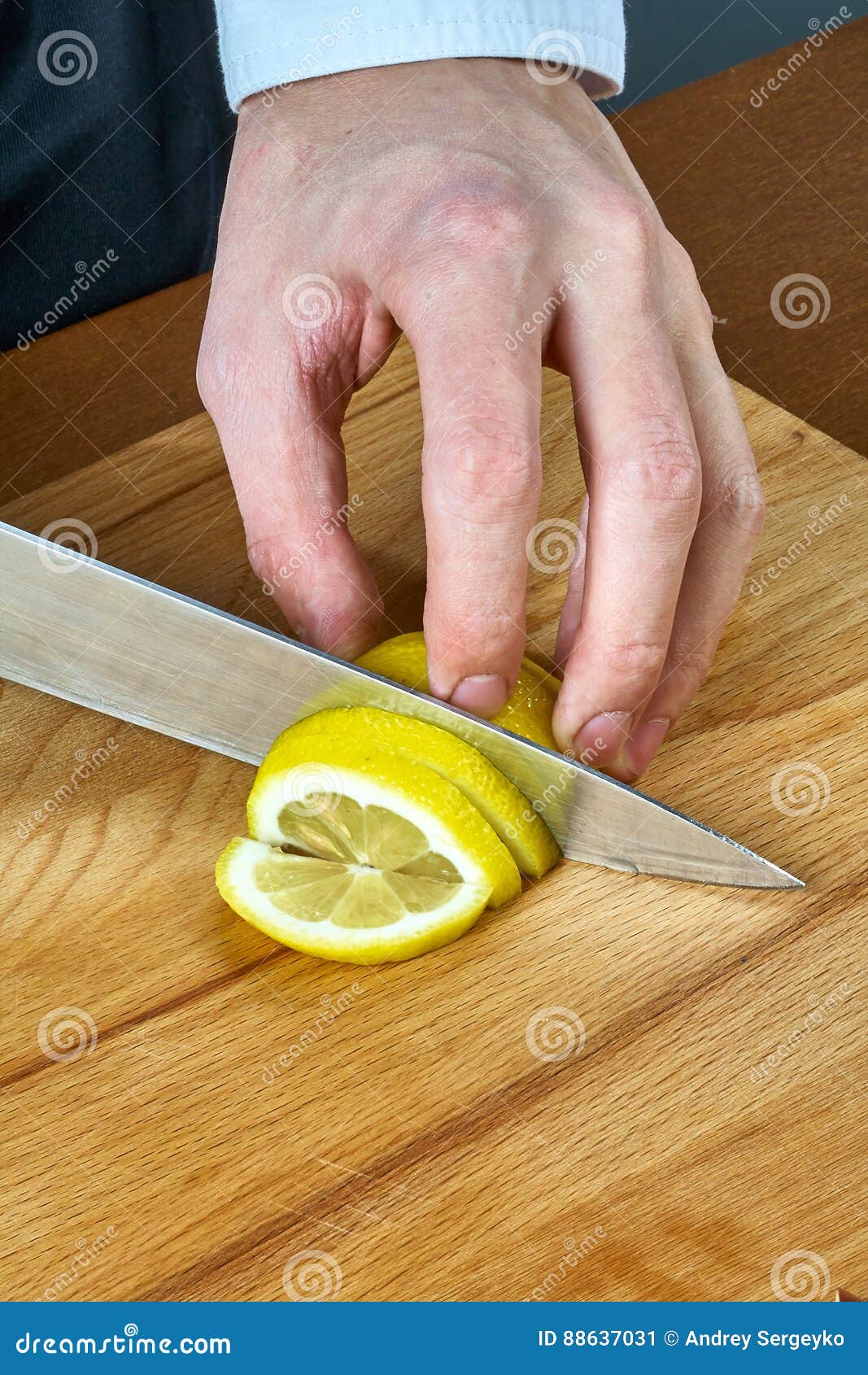 The Cook Cuts an Orange Lemon for Cooking Mulled Wine a Complete ...