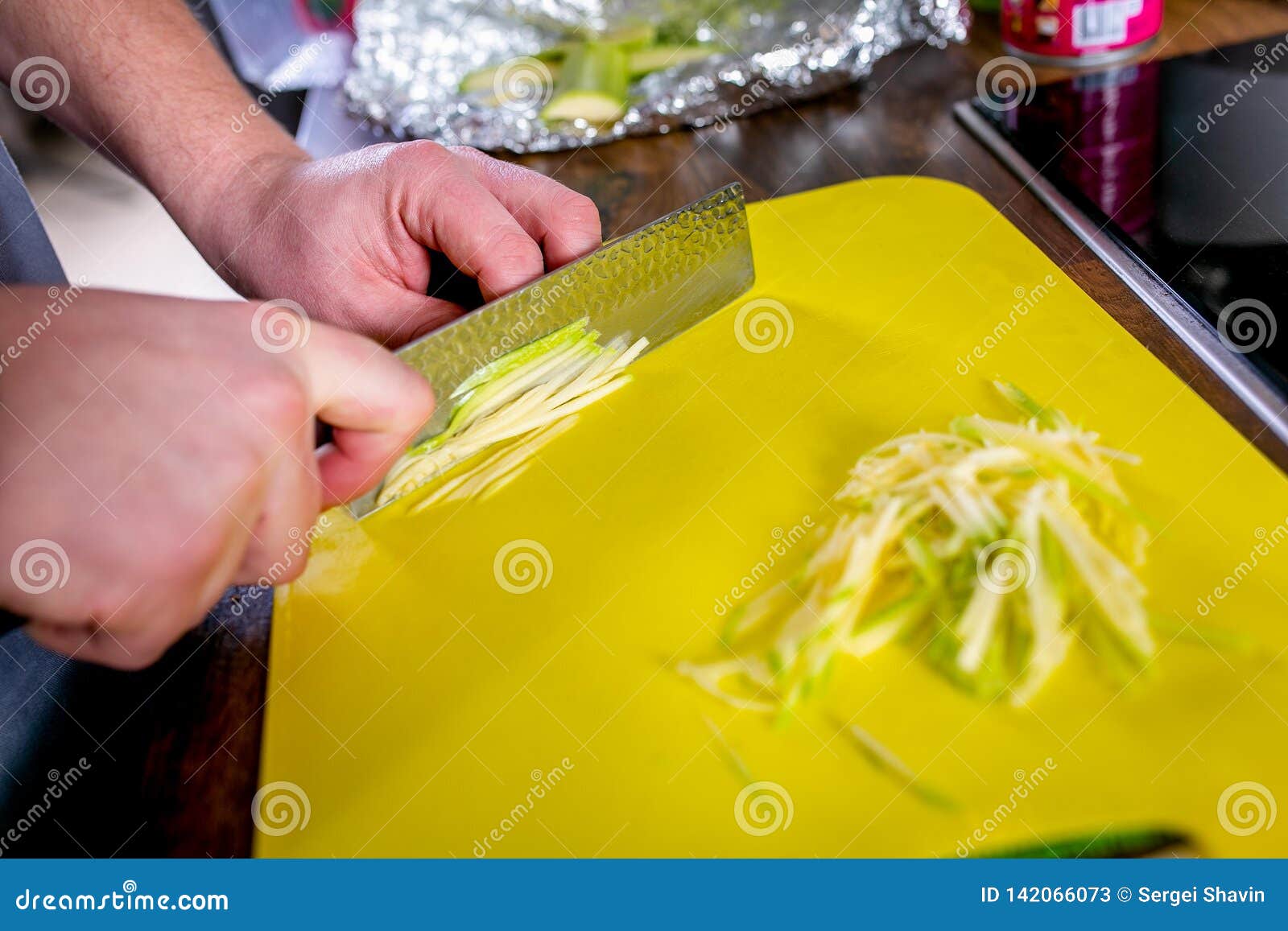 Cook Cuts a Pear on a Cutting Board. Master Class in the Kitchen. the ...