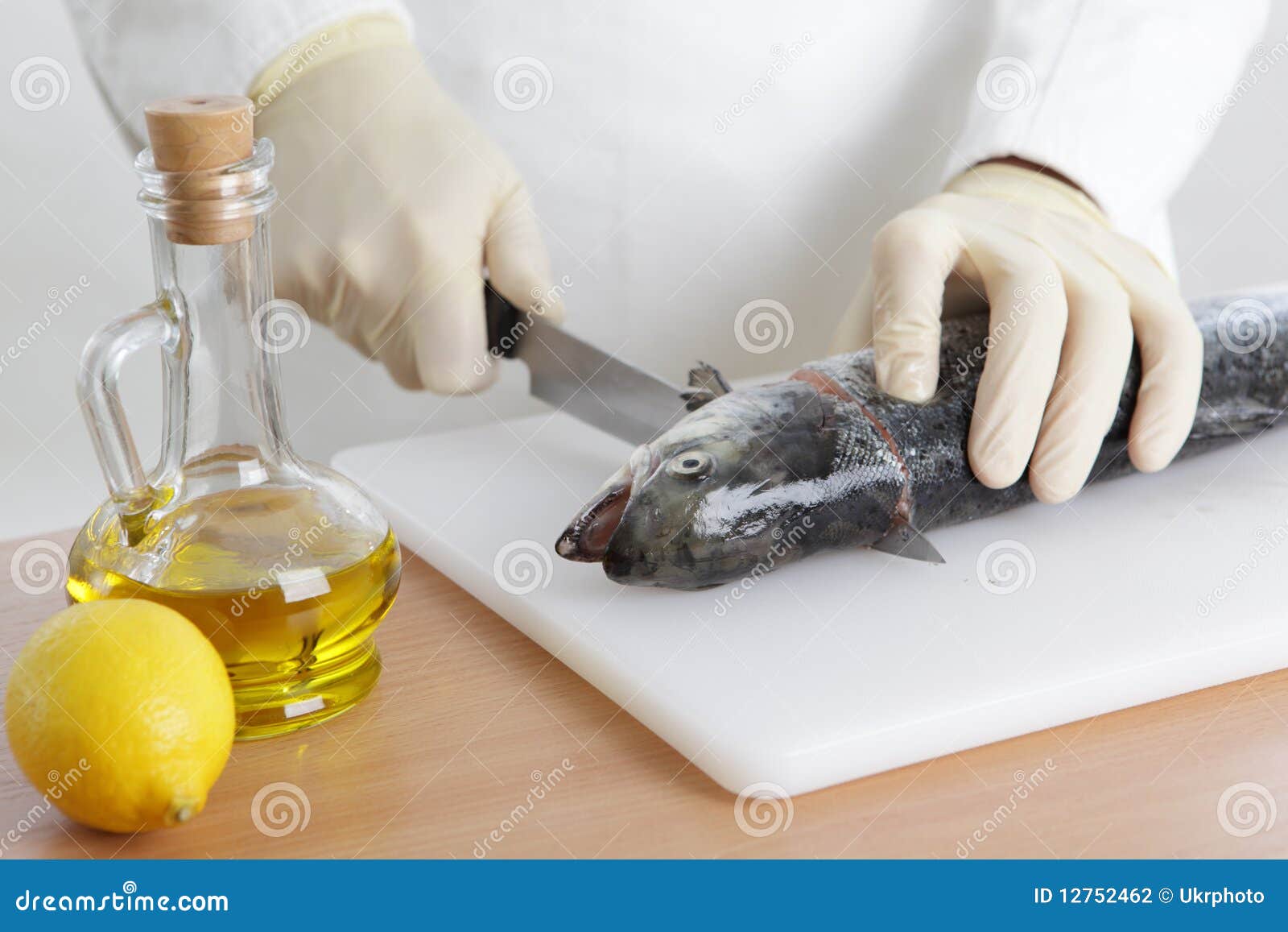 Cook cutting a fish stock photo. Image of kitchen, seafood - 12752462
