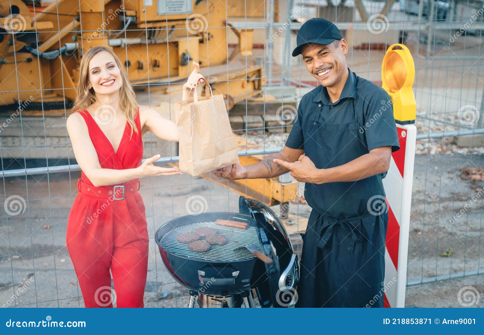 Cook Handing Woman Customer a Burger in Bag for Takeout Stock Image ...