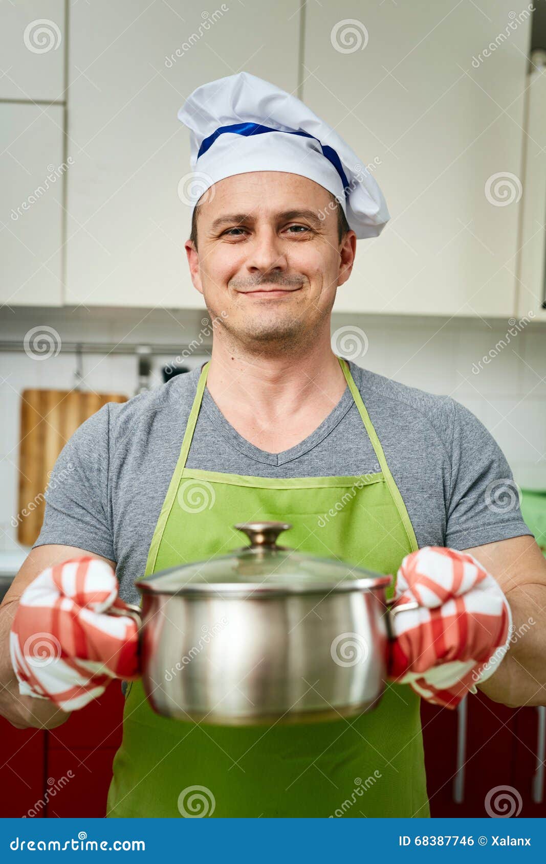 Cook holding a pot stock photo. Image of oven, stainless - 68387746