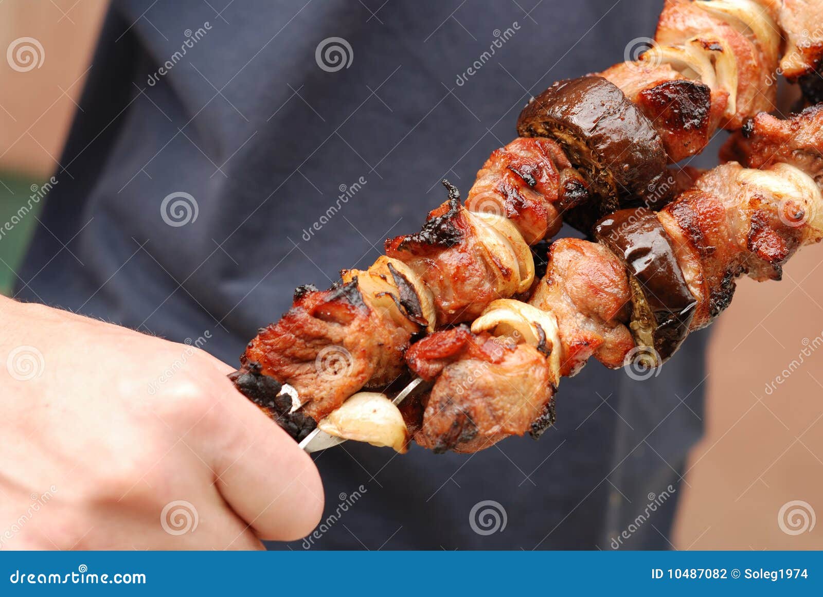 The Cook Holds the Prepared Meat in a Hand Stock Photo - Image of ...