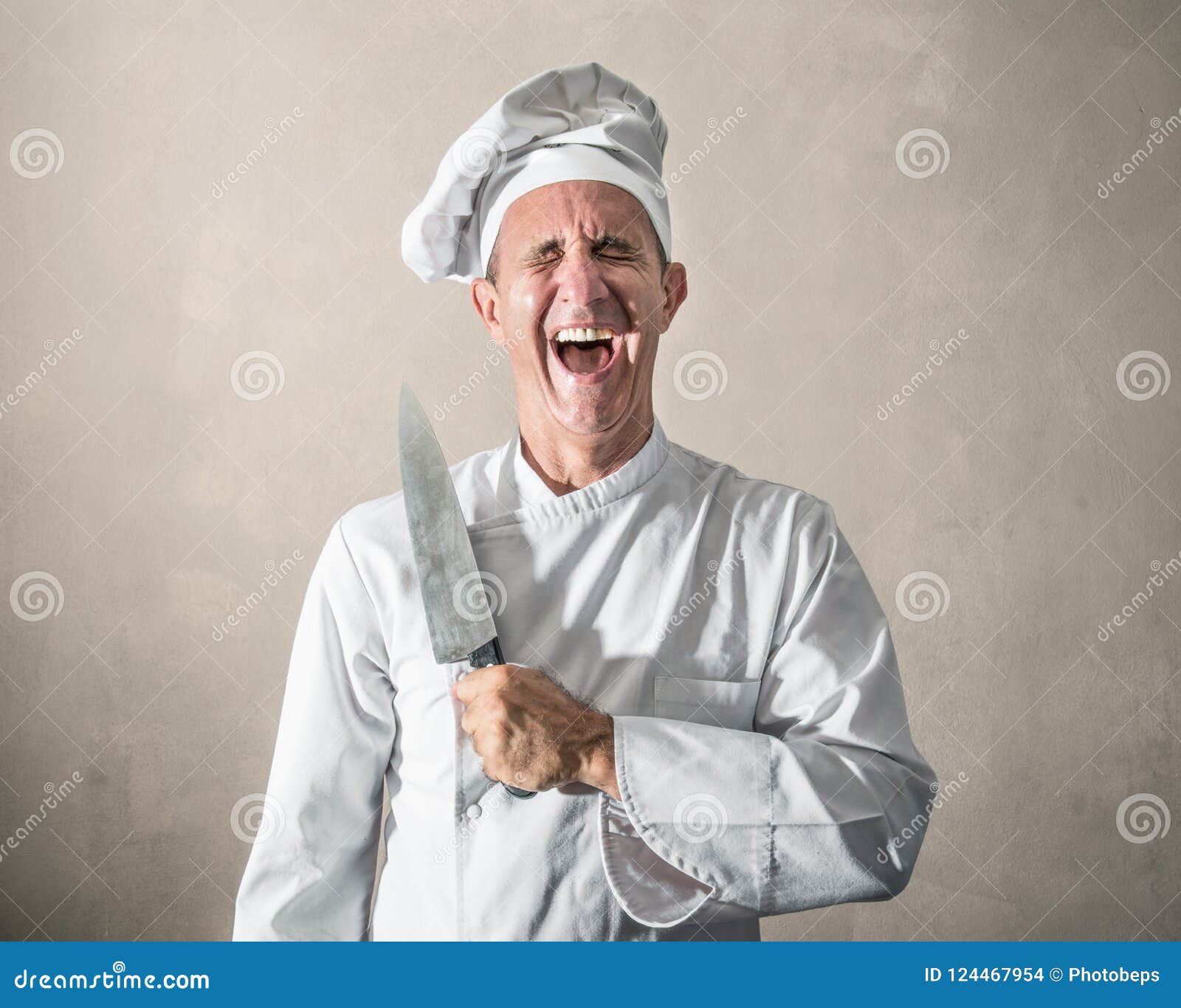 Cook Laughing with a Knife in Hand Stock Photo - Image of space ...