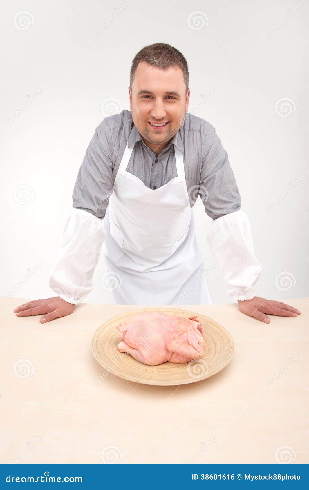 Cook Leaning on Table with Chicken and Plate Stock Photo - Image of ...