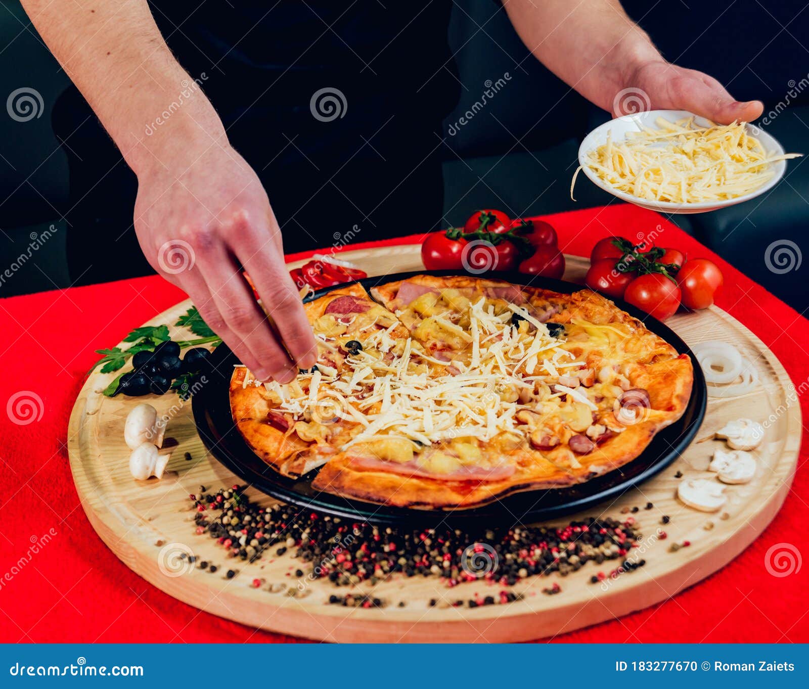 The Cook is Making Pizza. Adds the Ingredients Stock Photo - Image of ...