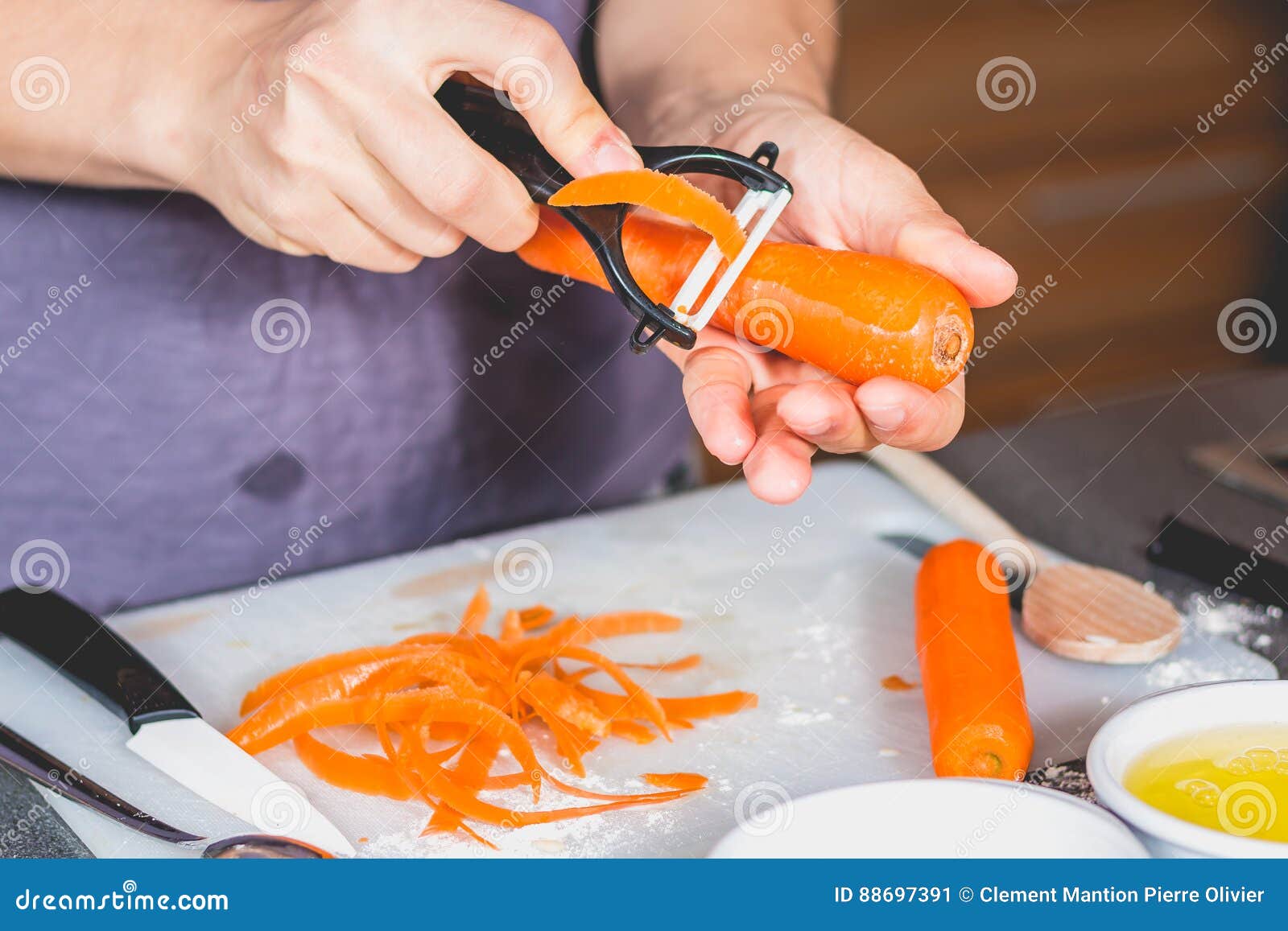 Cook Peeling Carrots with a Ceramic Knife Stock Image - Image of cook ...