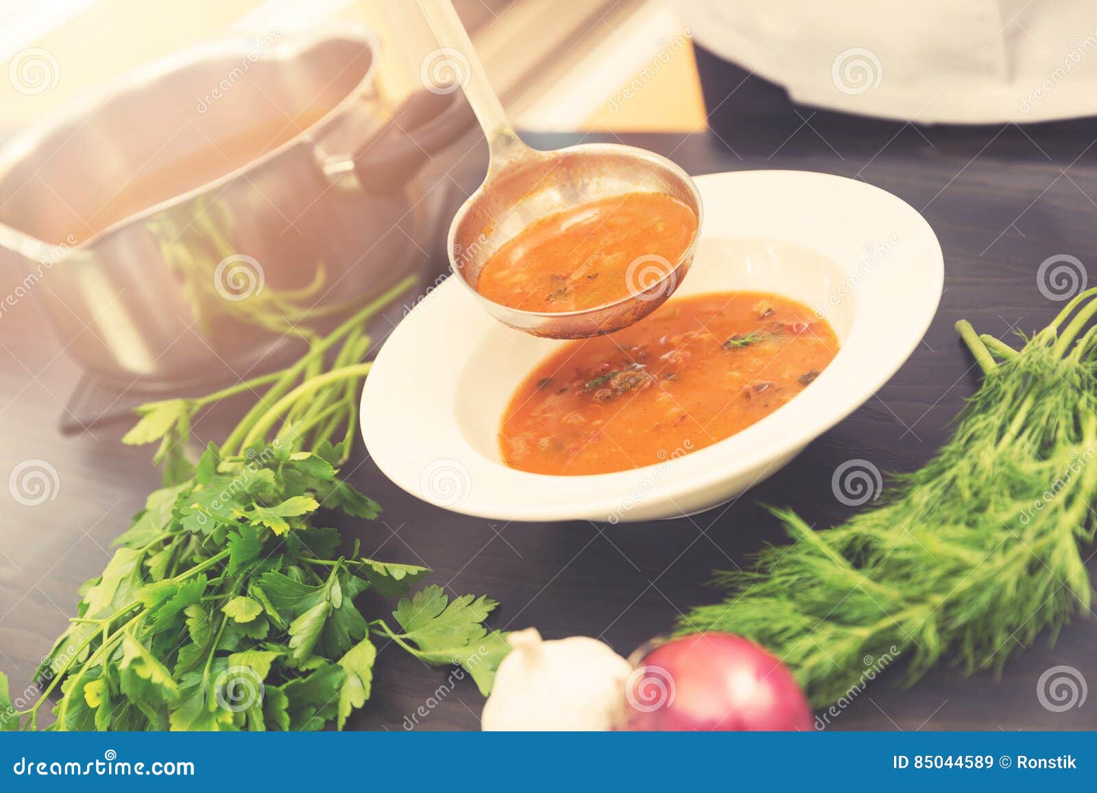 Cook Pouring Soup with Ladle into a Plate Stock Image - Image of ...
