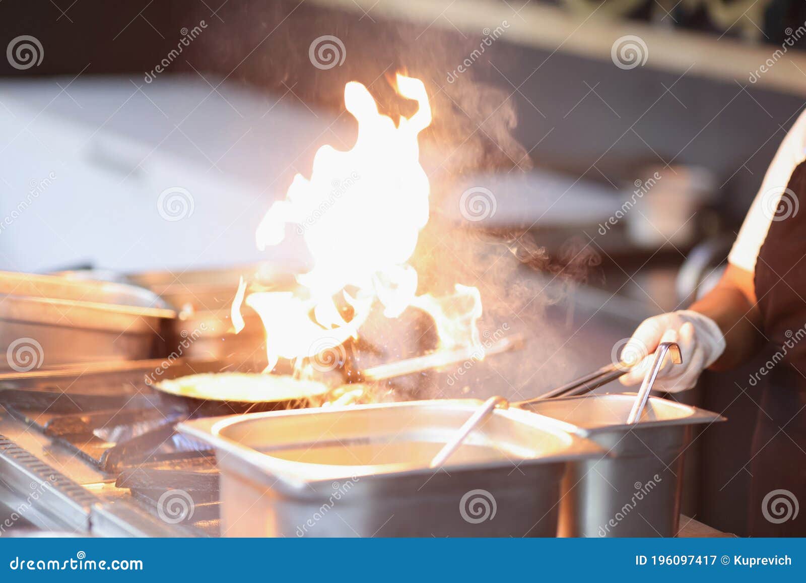 Cook prepares food on fire stock image. Image of culinary - 196097417