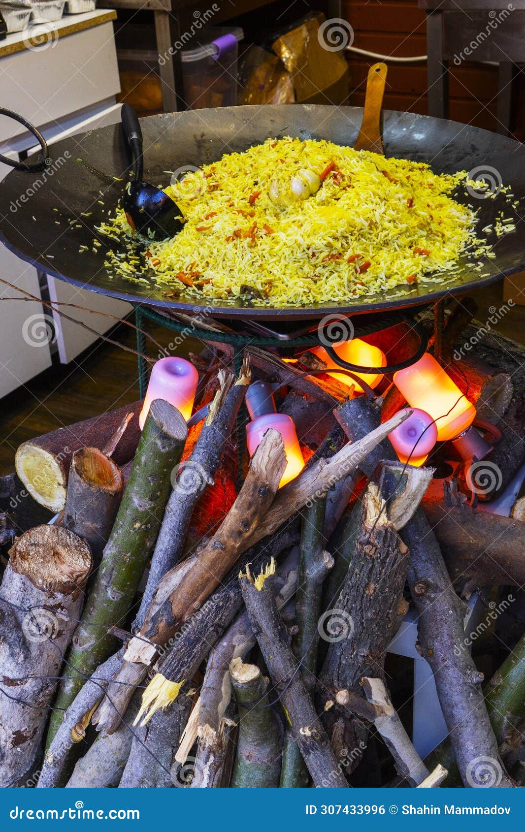 Cook Prepares Pilaf, a Dish of Rice and Meat on a Campfire in the ...