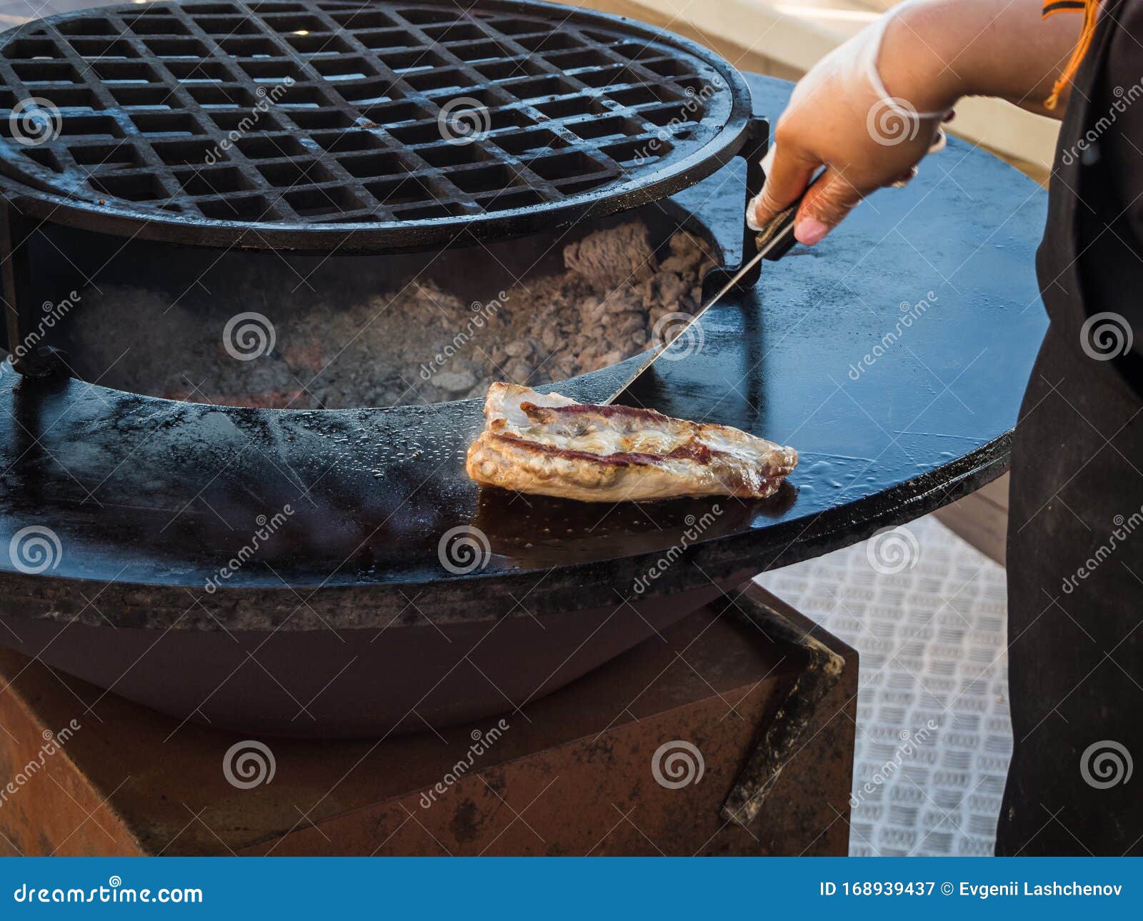 Cook Prepares Ribs on a Circular Grill in Sochi Stock Image - Image of ...