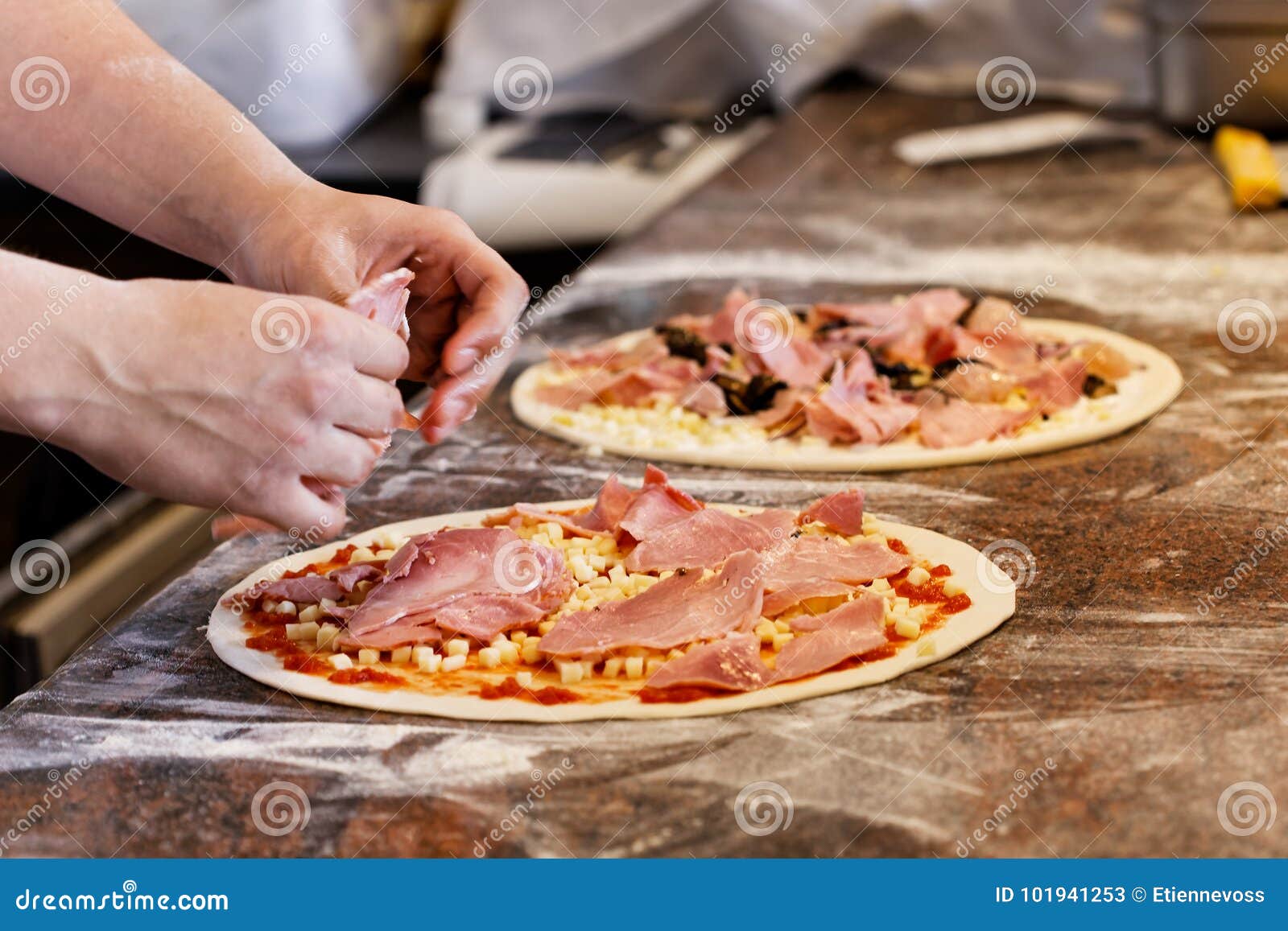 Cook Putting Toppings on Two Pizzas. Stock Image - Image of pizza ...