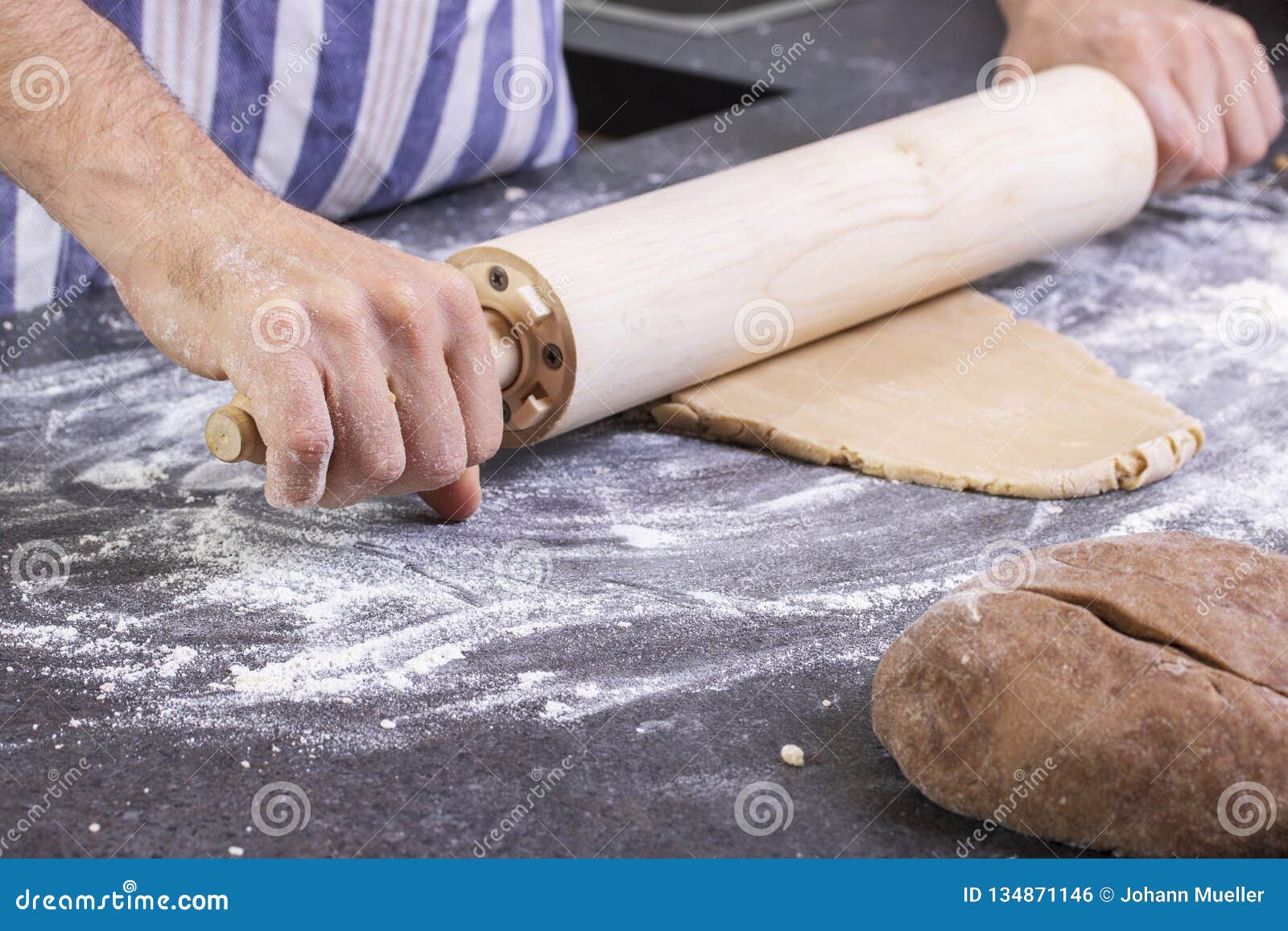 Cook Rolls Out the Dough on a Board, the Traditional Cooking Stock ...