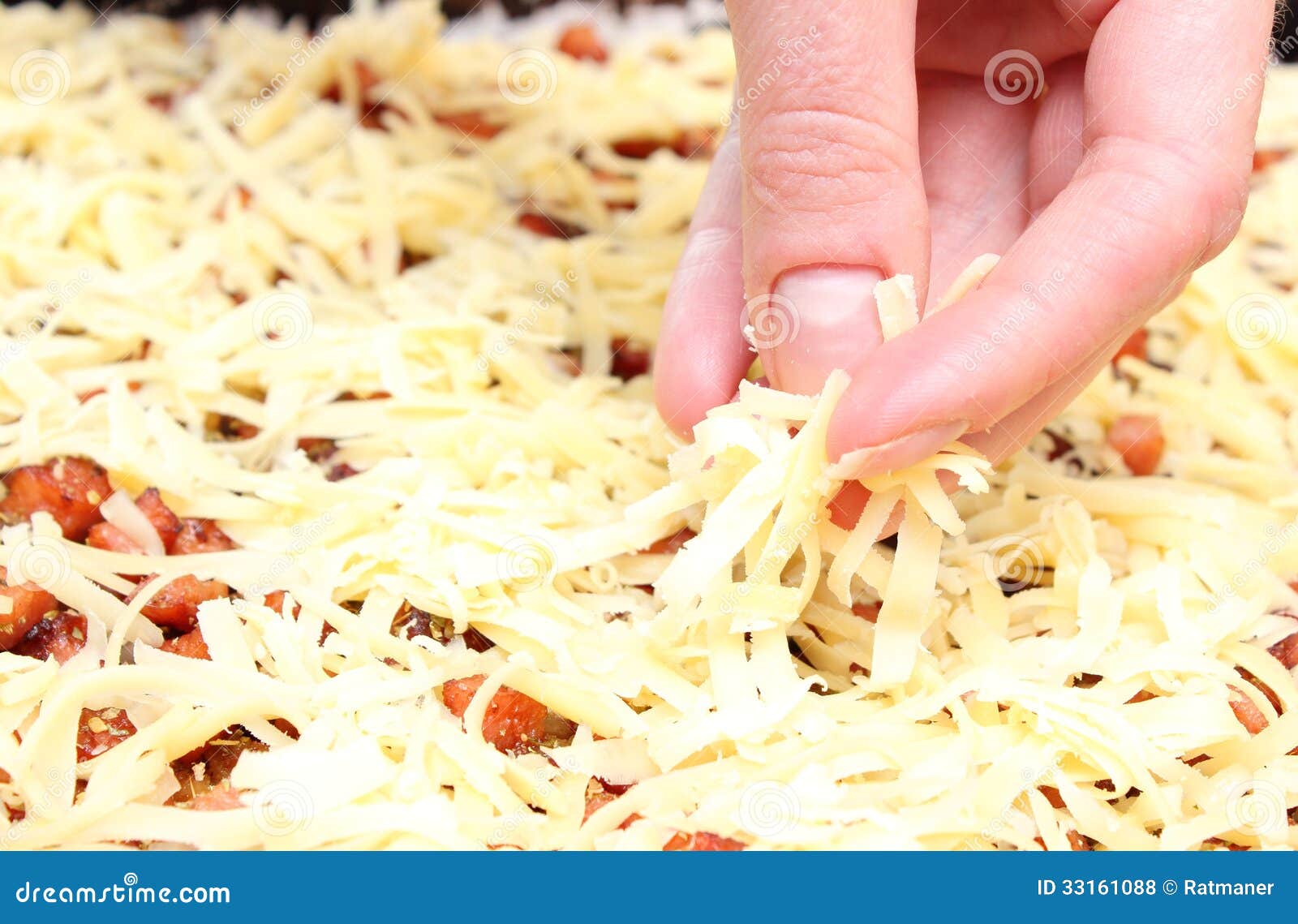 Cook s hand putting cheese stock photo. Image of cook - 33161088