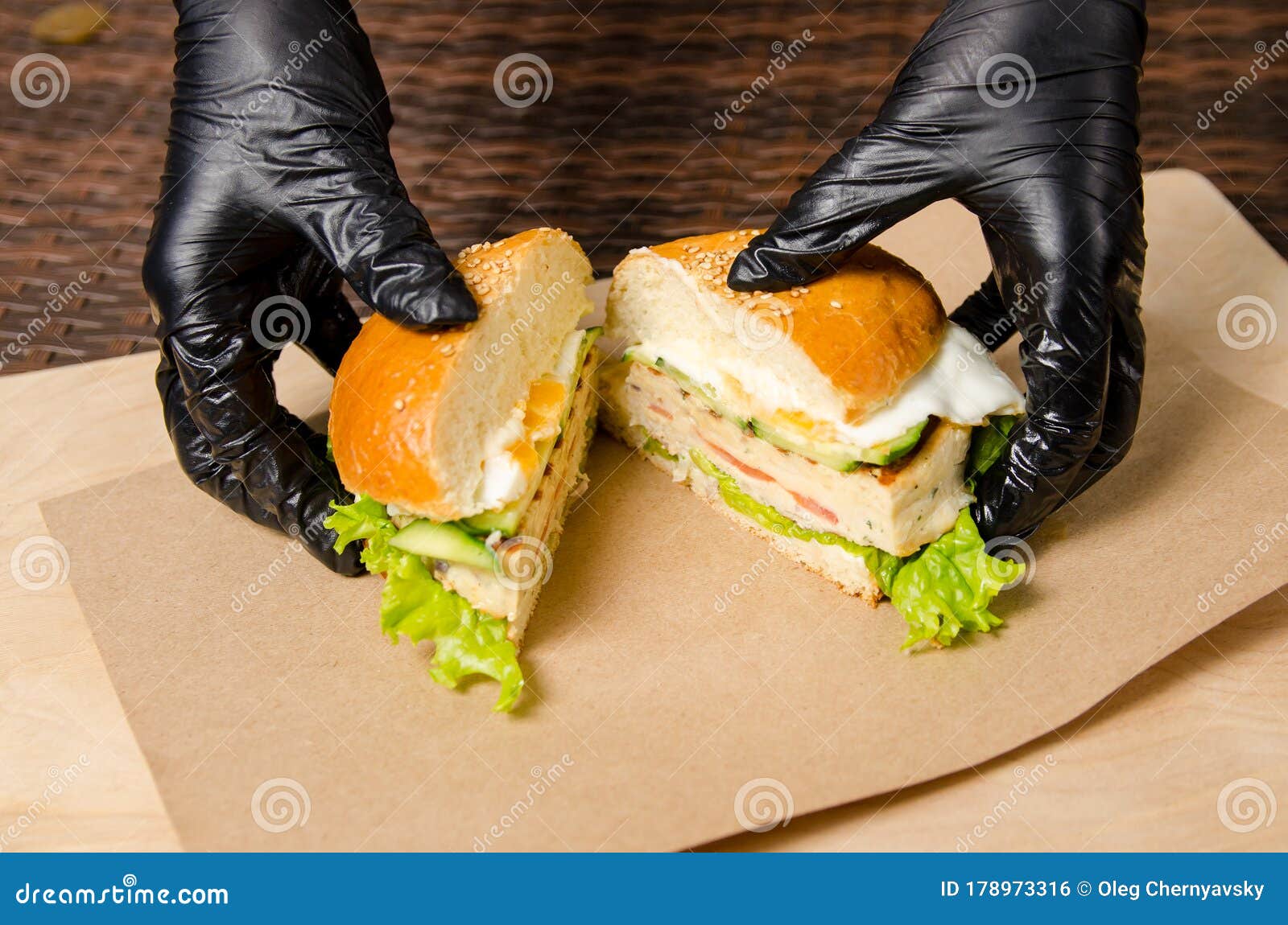 The Cook Shows the Middle of the Cut Chicken Burger Stock Photo - Image ...