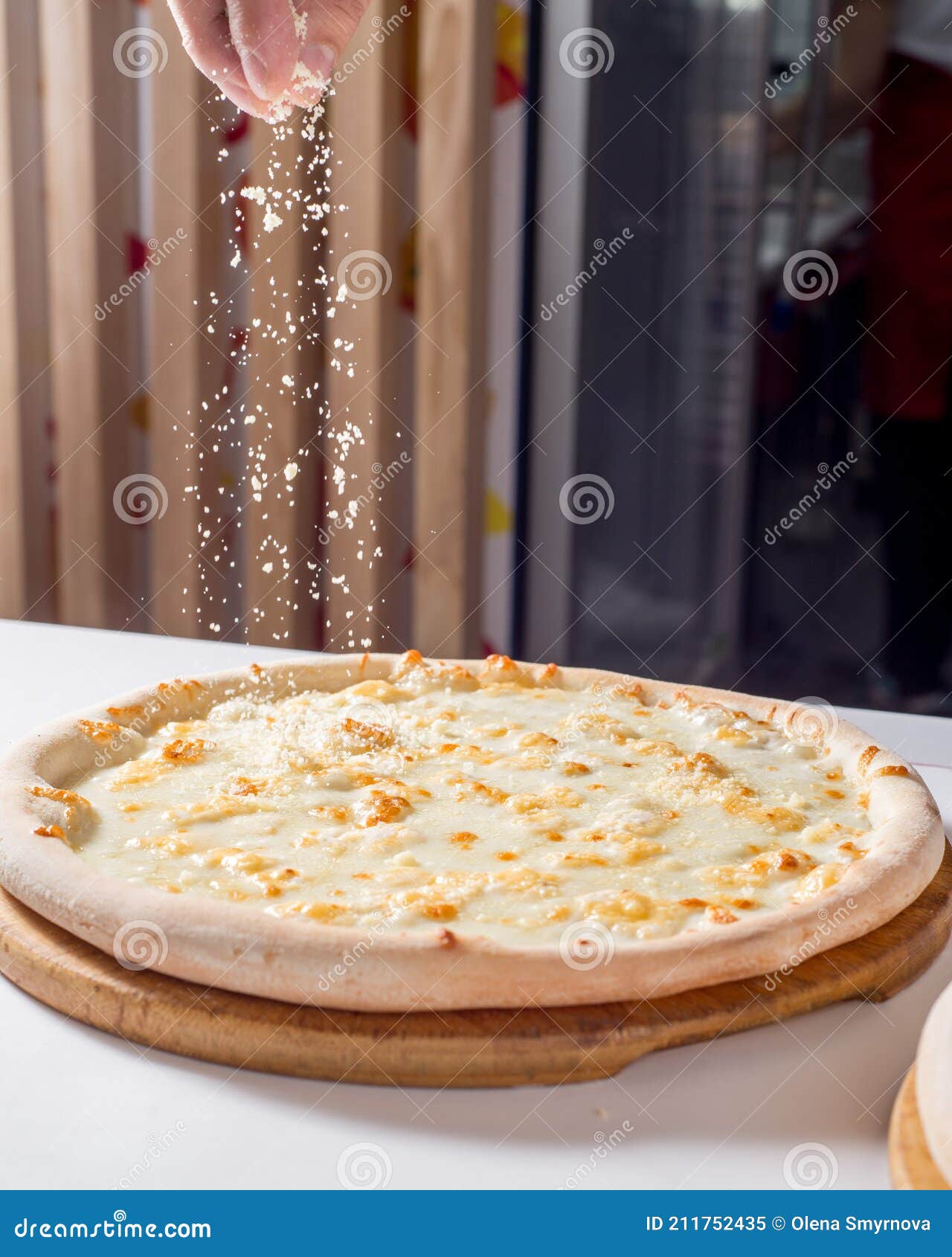 Cook Sprinkles the Cheese on the Pizza. Stock Image - Image of style ...