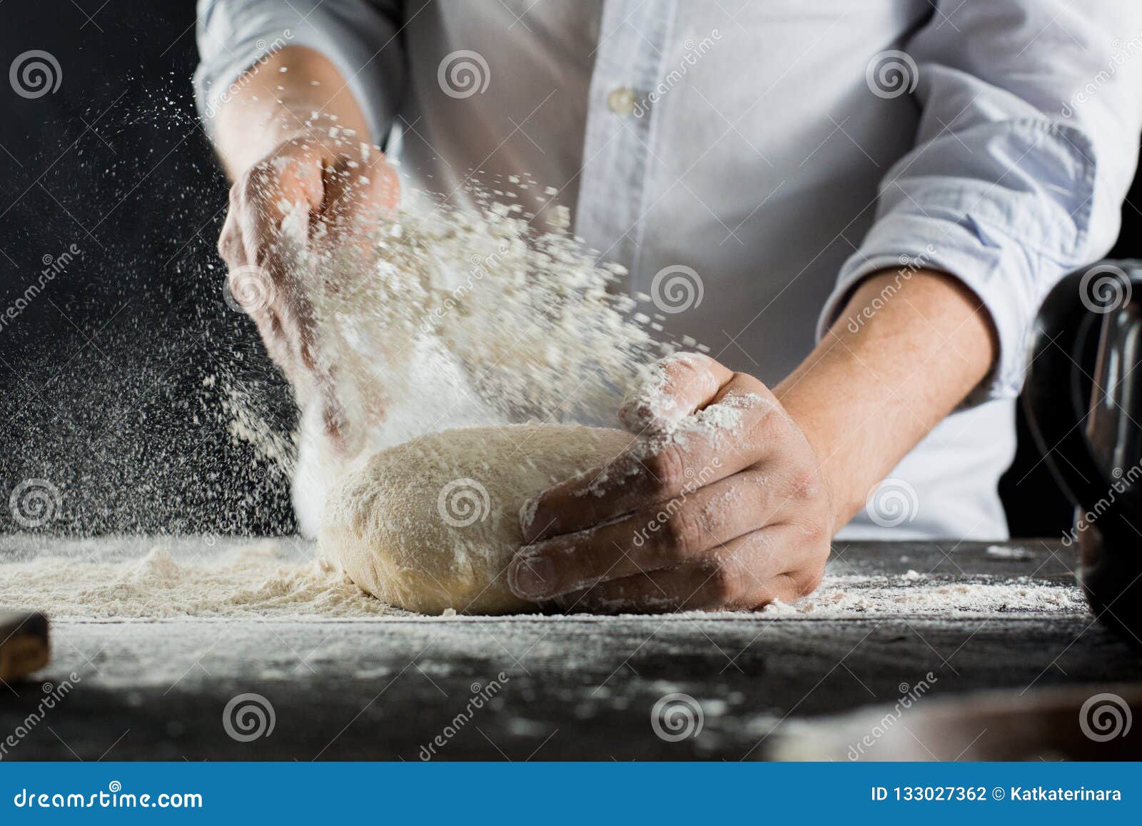Cook Sprinkles Dough with Flour on the Kitchen Table Stock Photo ...