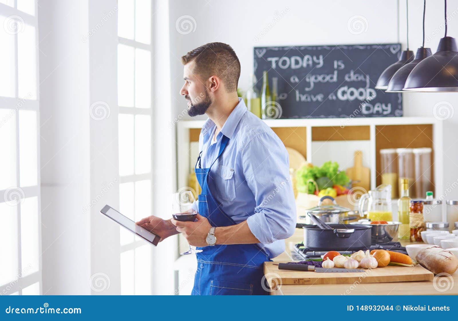 Cook with a Tablet in Hand and Studying the Recipe Stock Photo - Image ...