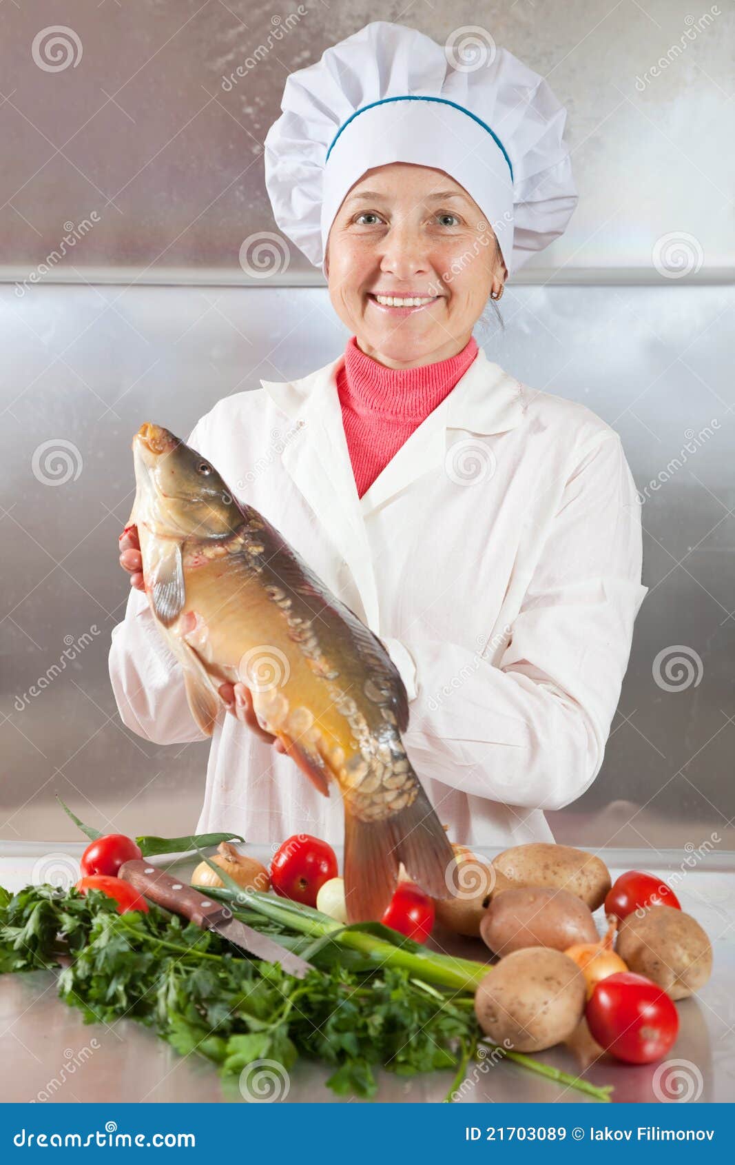 Cook woman with carp fish stock image. Image of culinary - 21703089