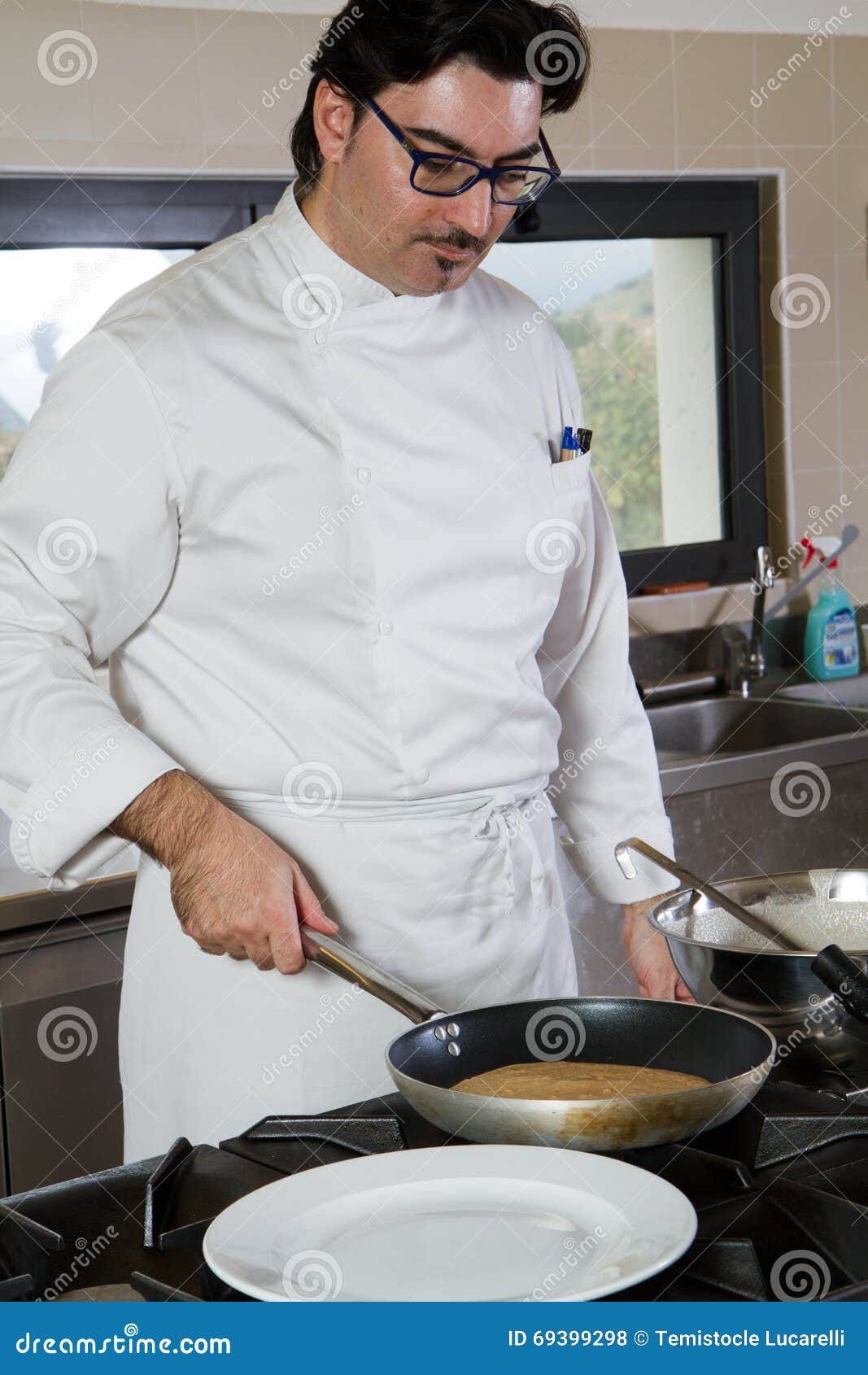 Cook at work stock photo. Image of professional, holding - 69399298