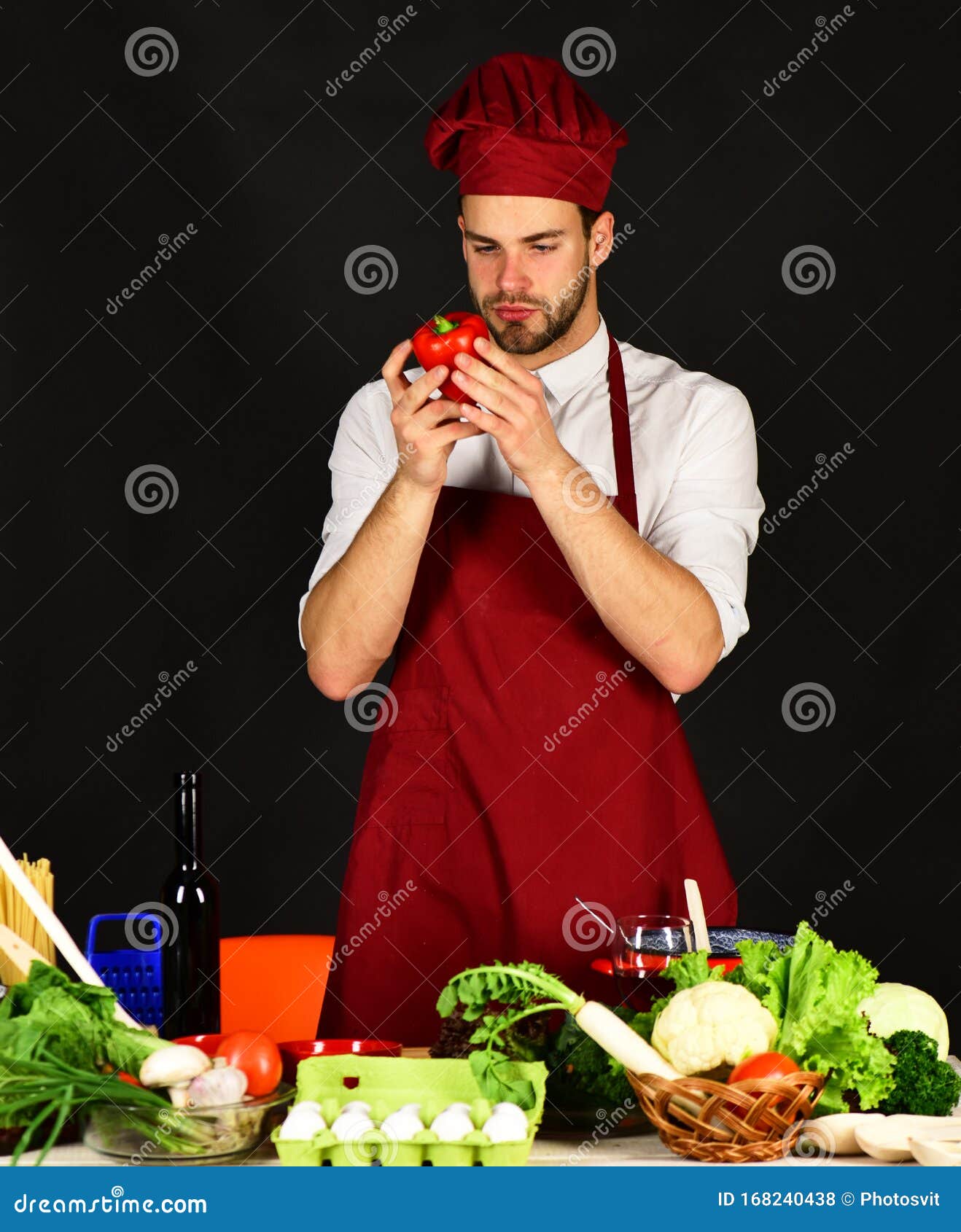 Cook Works in Kitchen Near Table with Vegetables and Tools. Stock Photo ...
