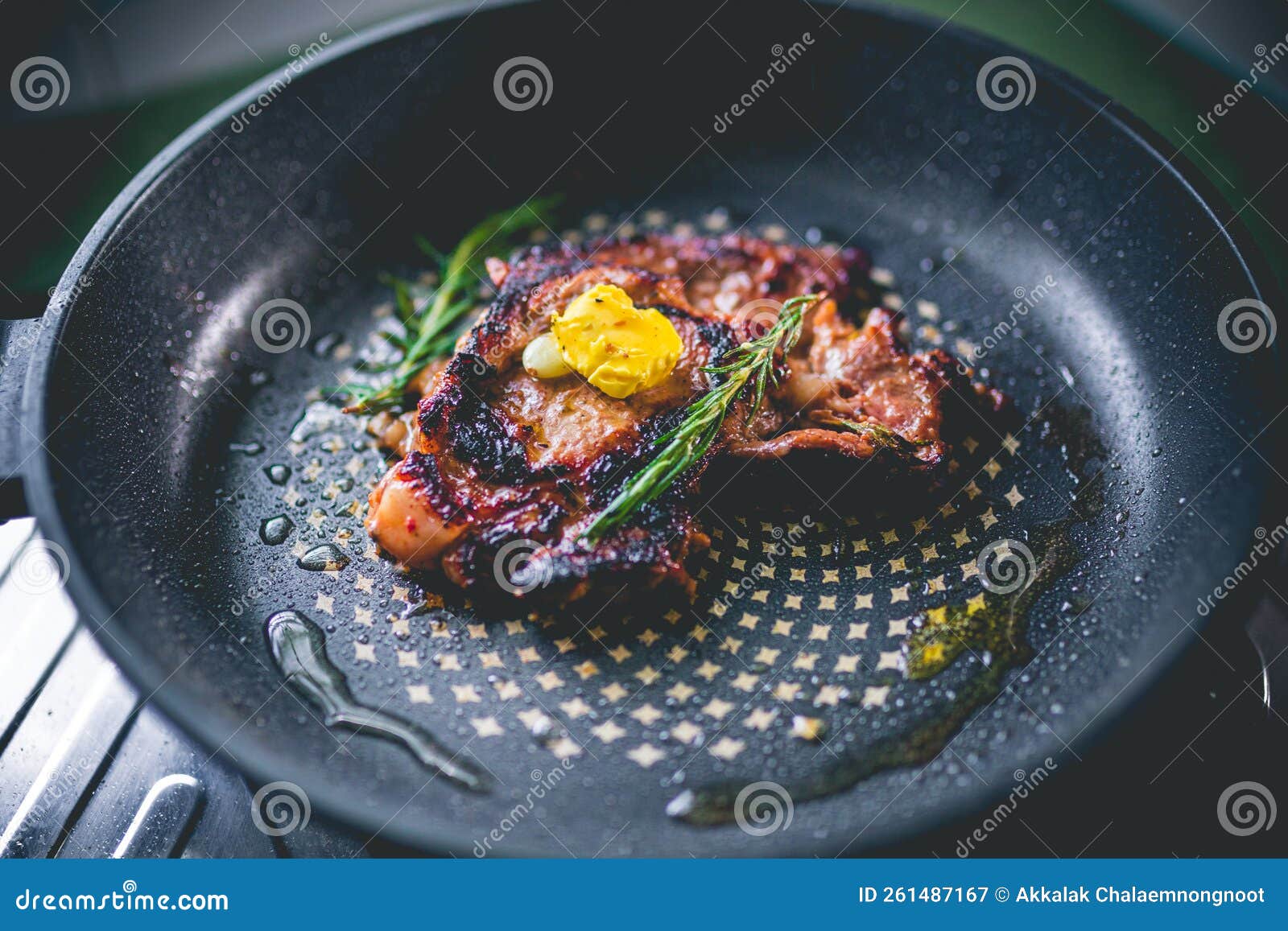 Cooked Beef Steak with Rosemary and Garlic Inside Iron Skillet Stock ...