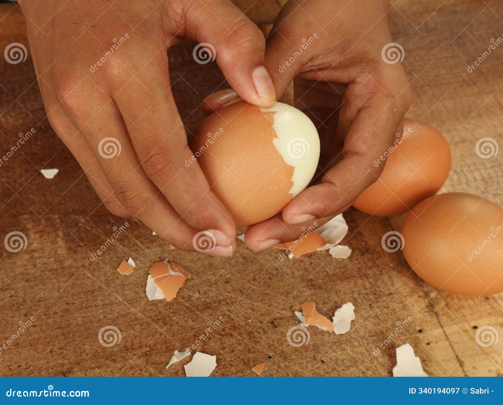 Someone is Peeling the Shell of a Cooked Egg Stock Image - Image of ...