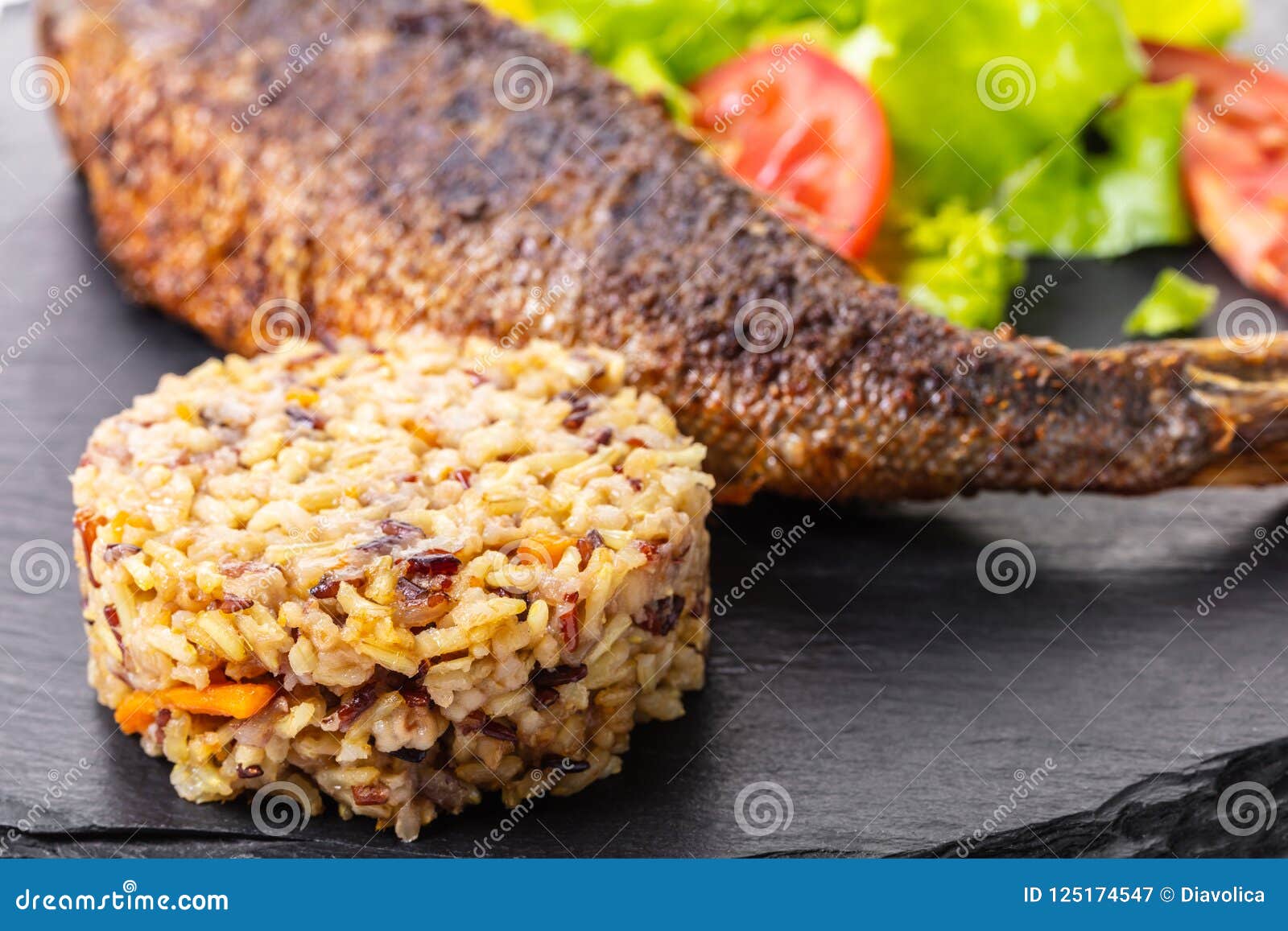 Cooked fish with rice stock image. Image of meat, closeup - 125174547