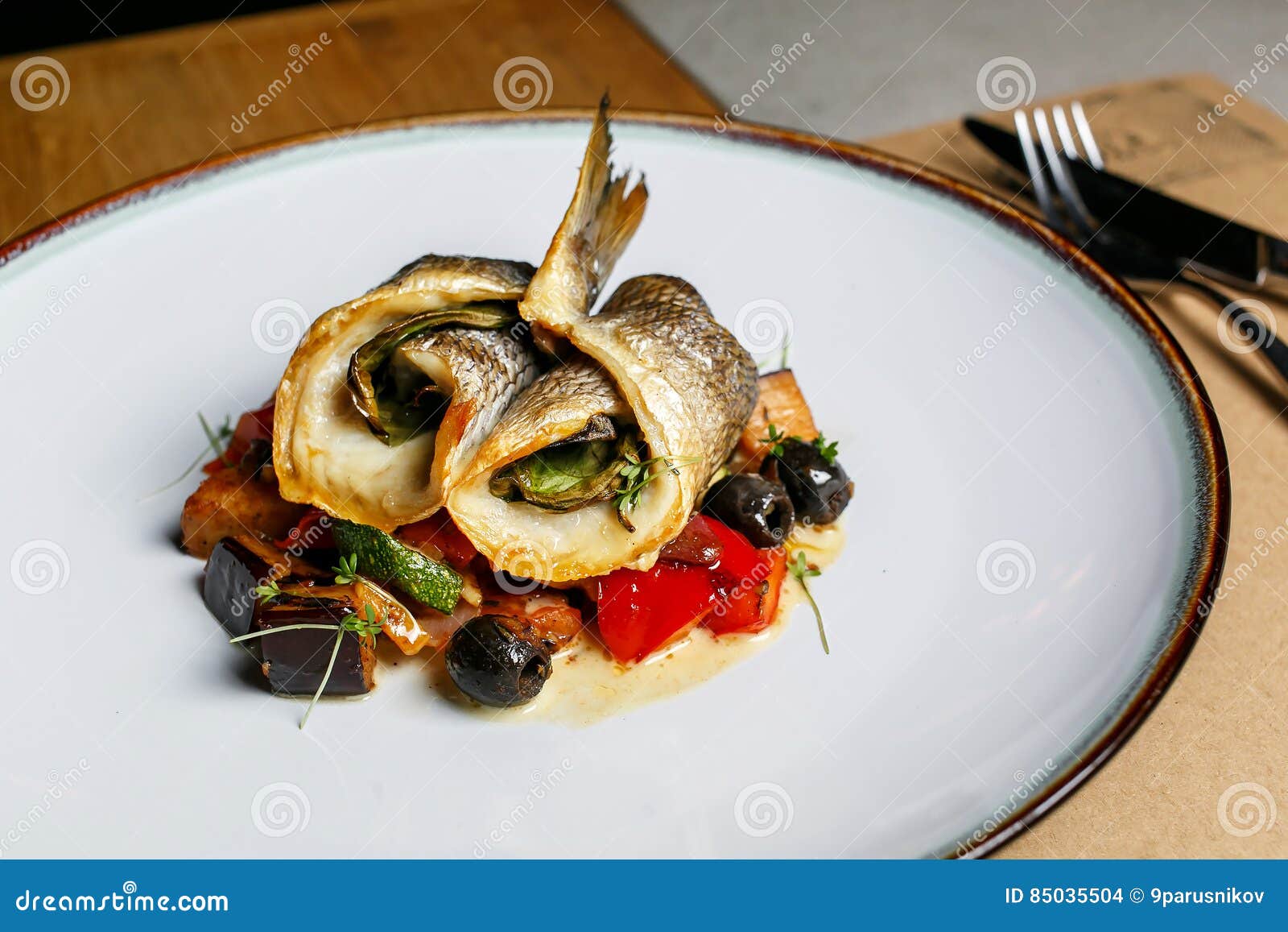 Cooked Fish in a Roll with Vegetables Stock Photo - Image of gold ...