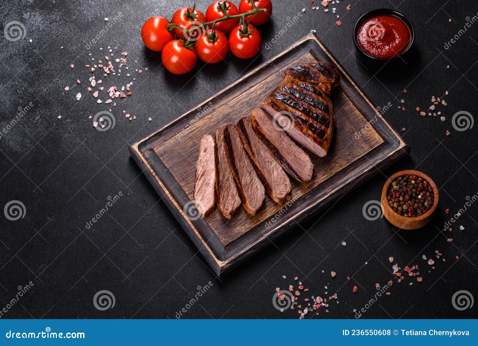 Cooked Grilled Chuck Eye Roll Steak on a Chopping Board Stock Photo ...