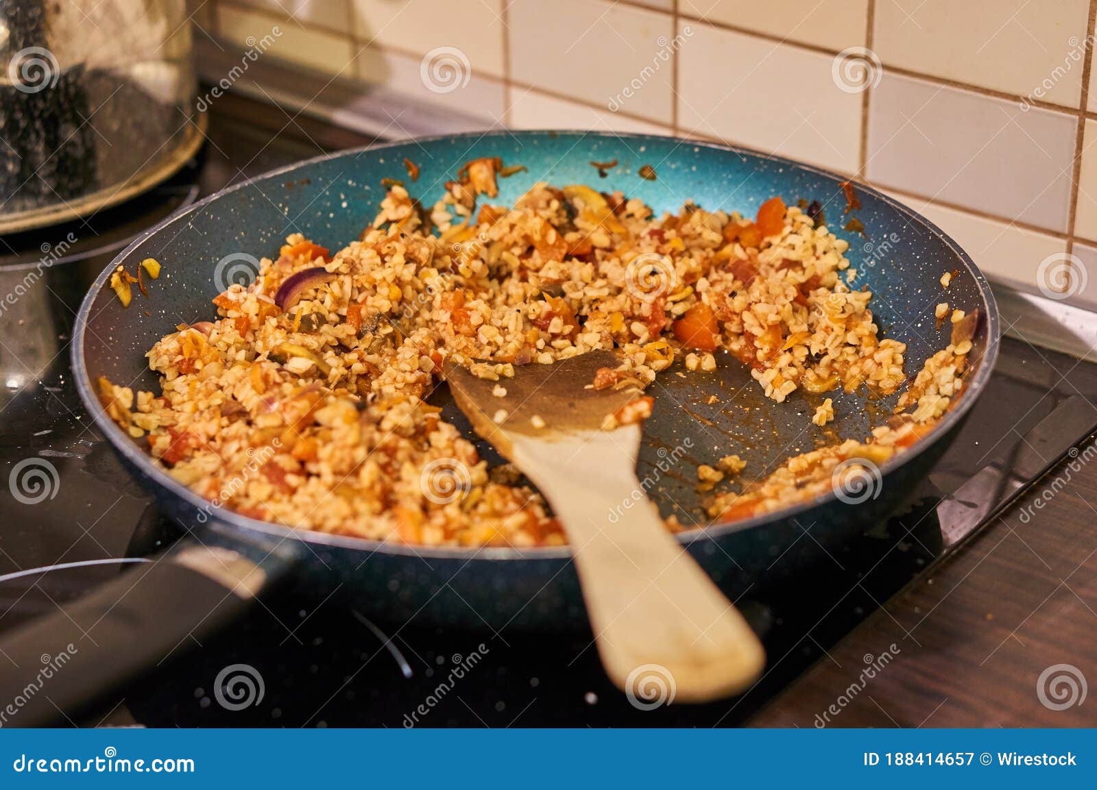 Cooked Groats in Tomato Sauce and Cut Vegetables in a Pan Stock Image ...