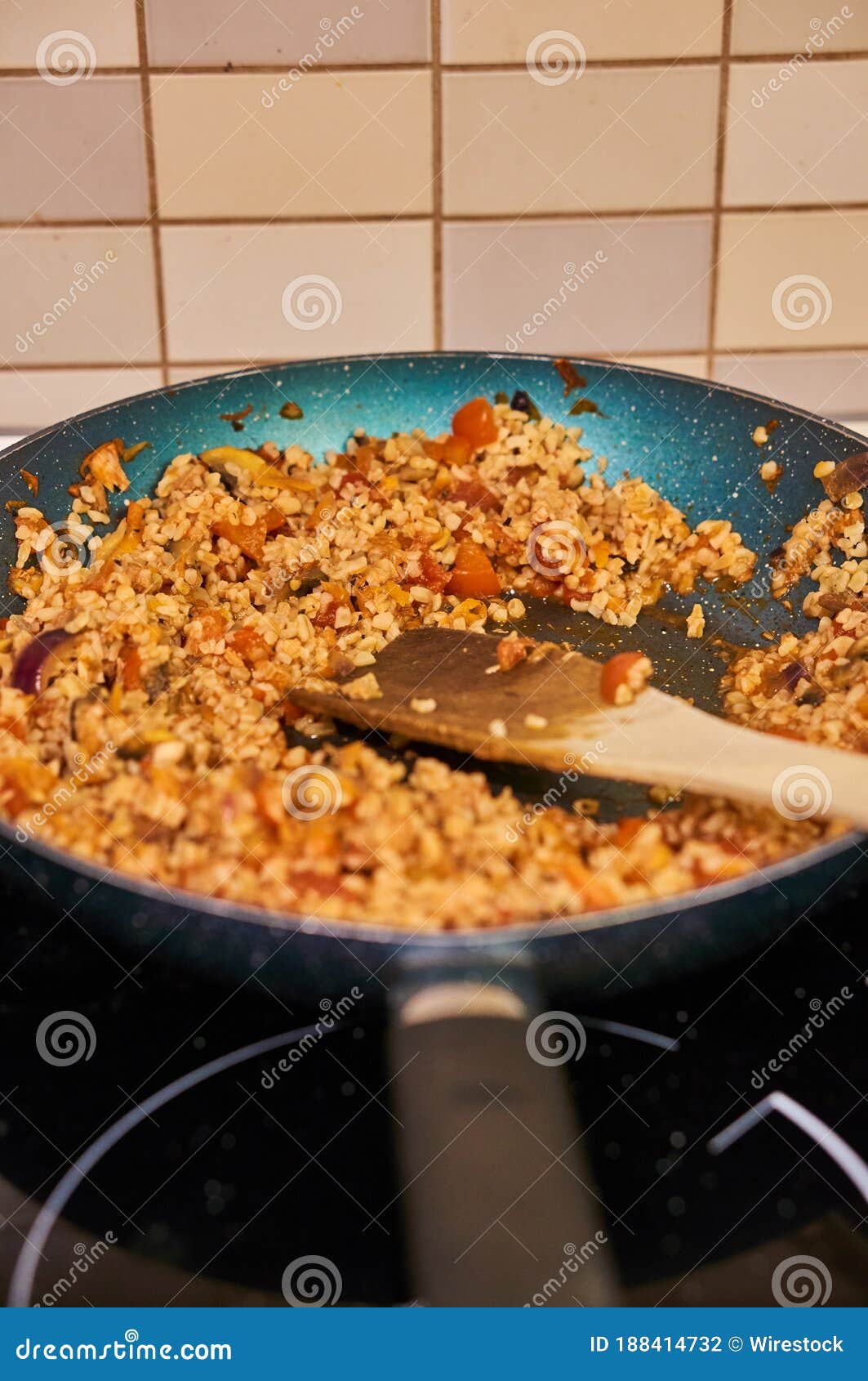 Cooked Groats in Tomato Sauce and Cut Vegetables in a Pan Stock Photo ...