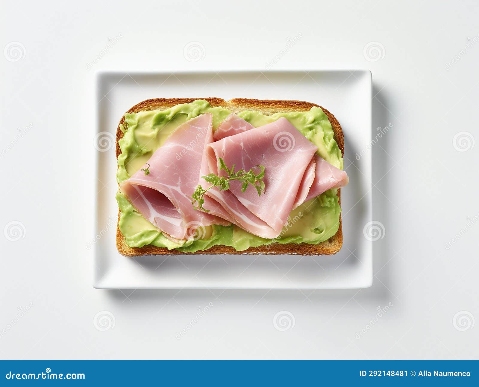 Cooked Ham on a Rectangular Piece of Bread Spread with Avocado Purée ...