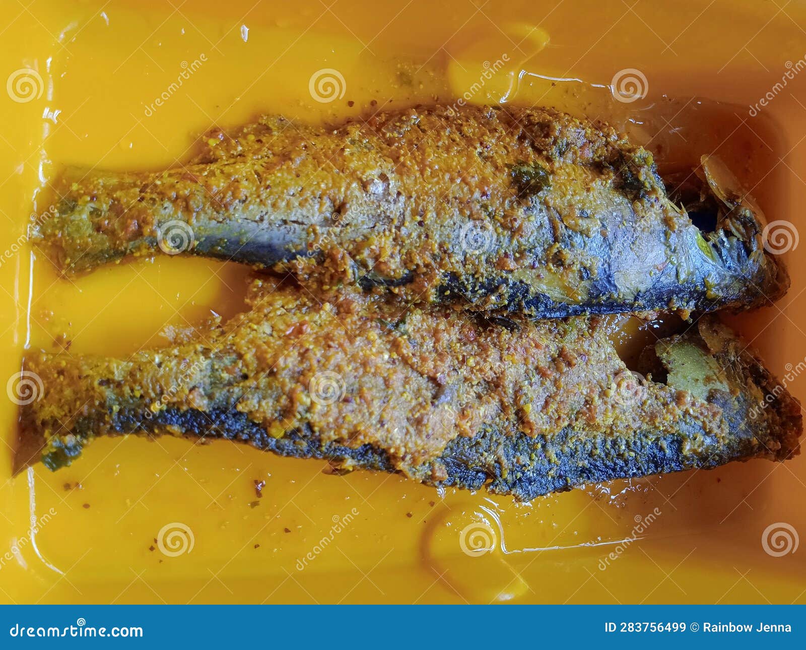 Cooked Hilsa Fish with Mustard Sauce in a Yellow Bowl Stock Image ...