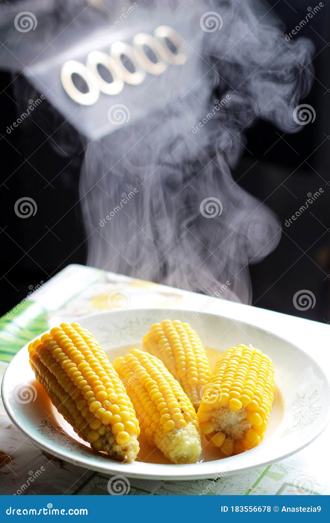 Cooked Hot Yellow Sweet Corn on Plate with Steam on the Dinner Table ...