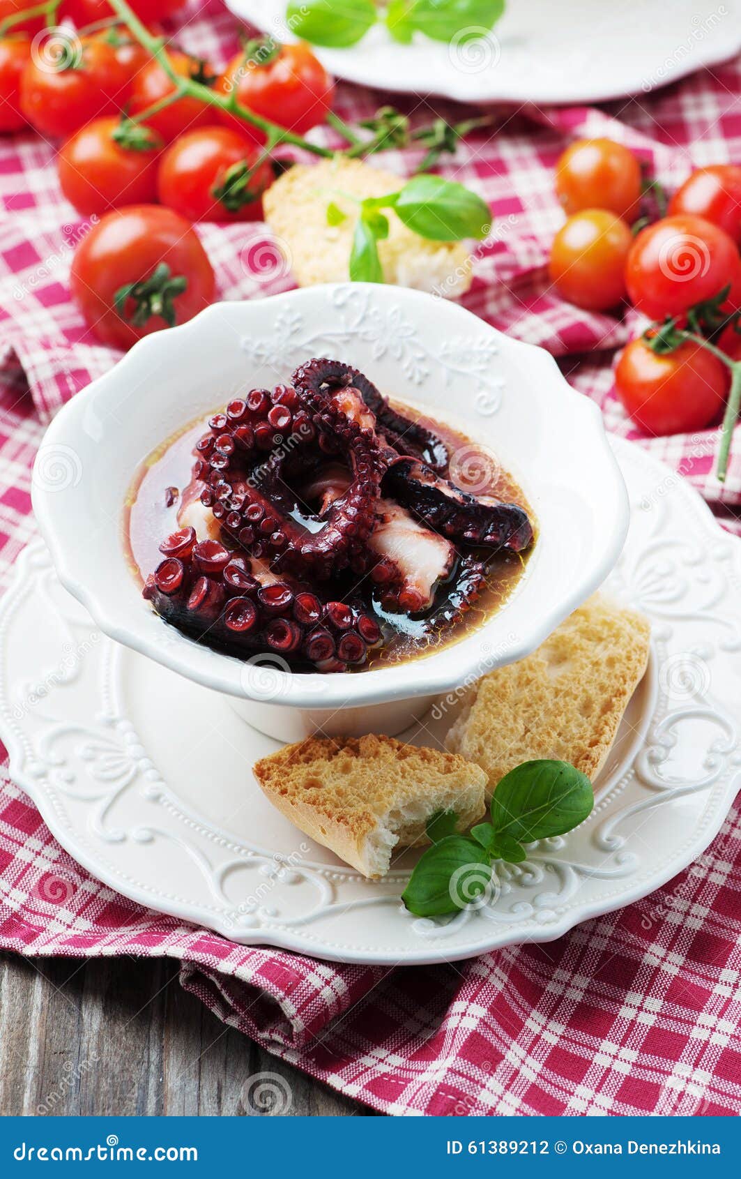 Cooked octopus with bread stock photo. Image of meal - 61389212