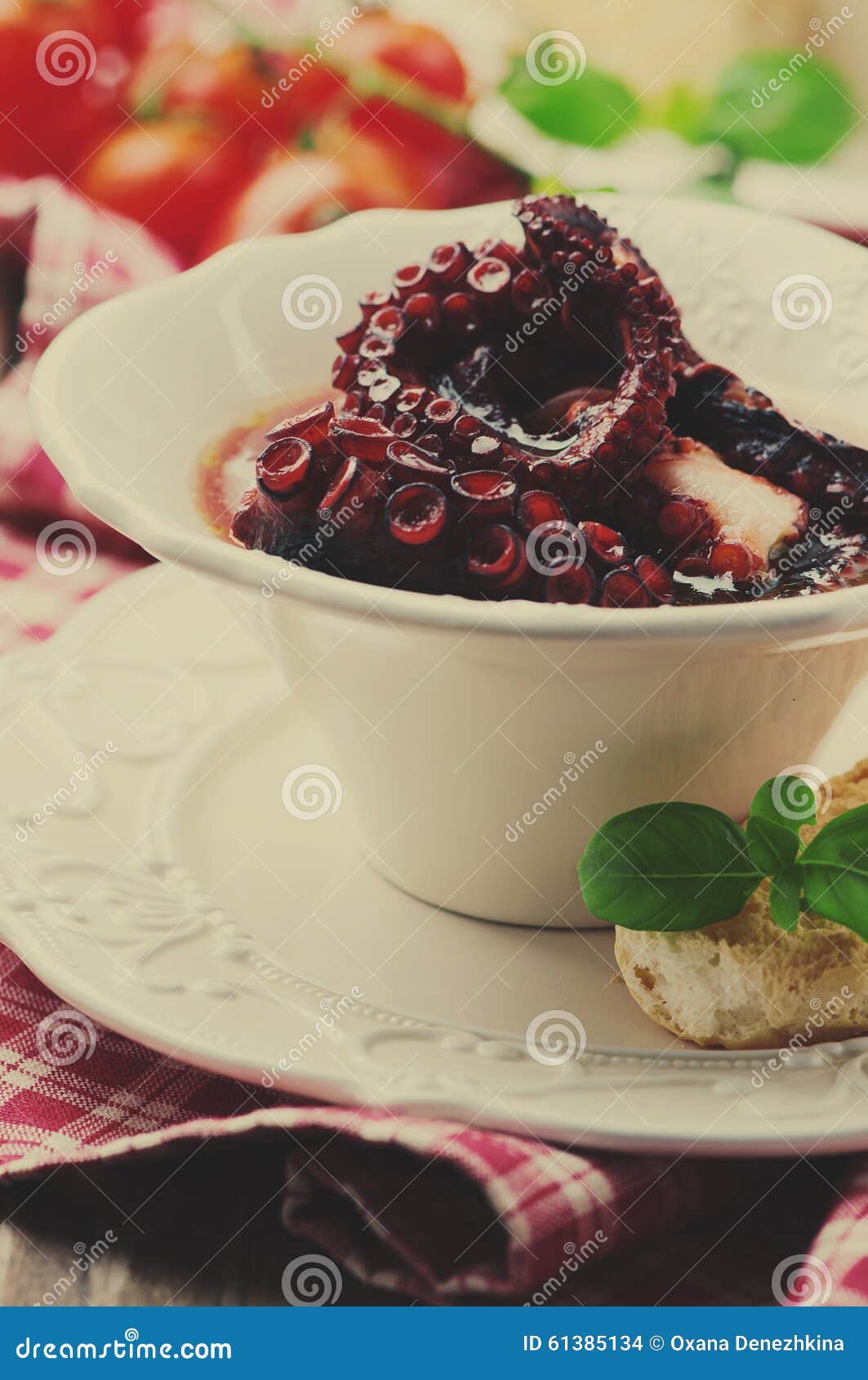 Cooked octopus with bread stock photo. Image of meal - 61385134