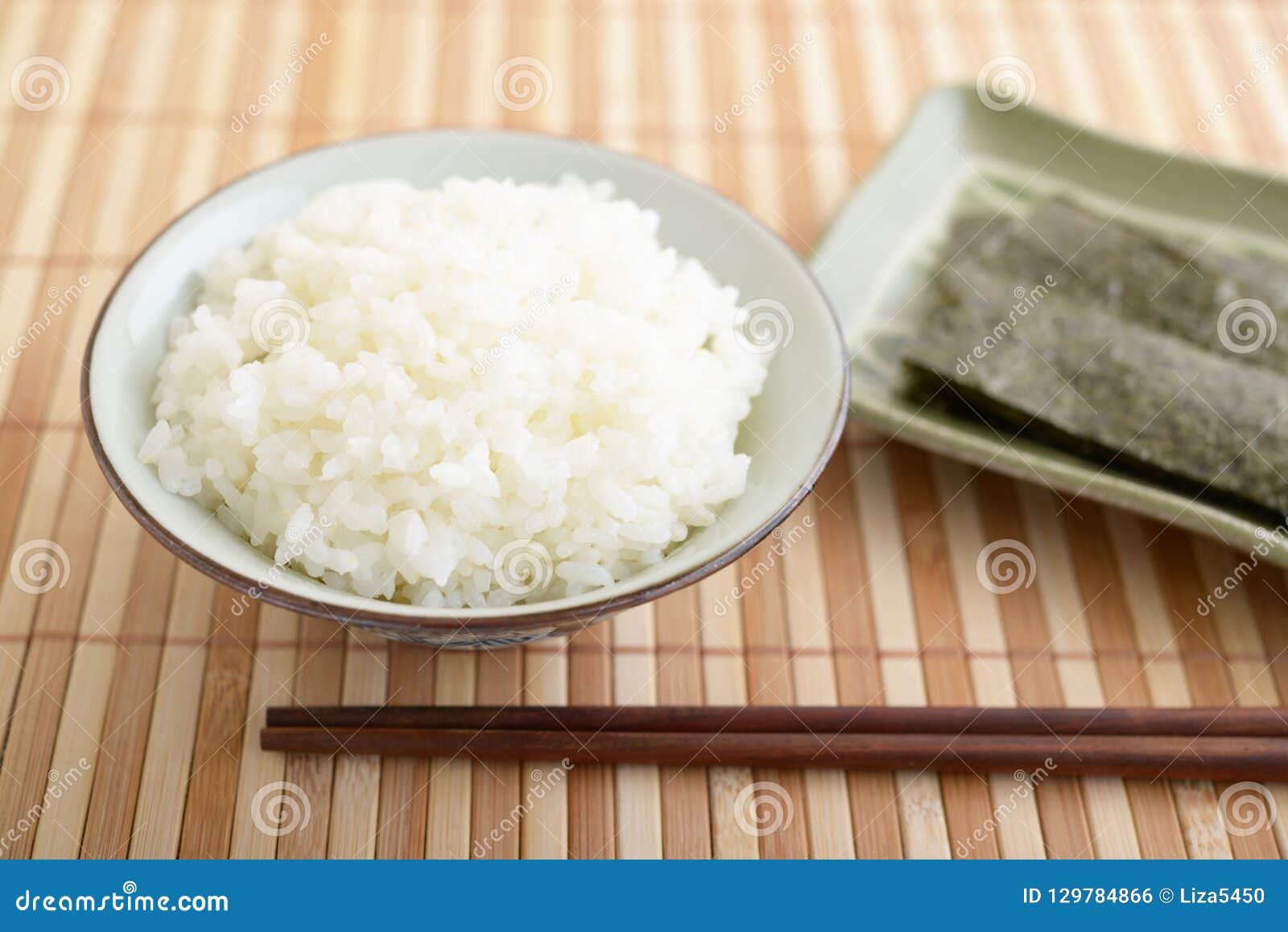 Cooked rice in bowl stock photo. Image of grain, delicious - 129784866