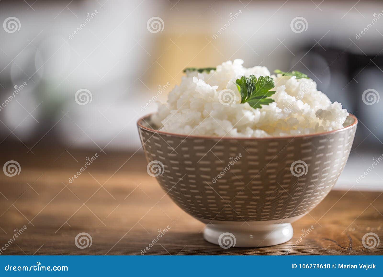 Cooked Rice in Bowl on Kitchen Table - Close Up Stock Photo - Image of ...