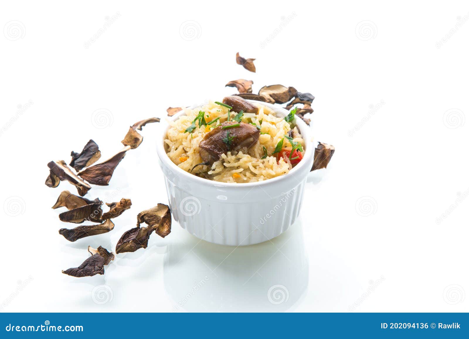 Cooked Rice with Dried Forest Mushrooms Isolated on White Stock Photo ...