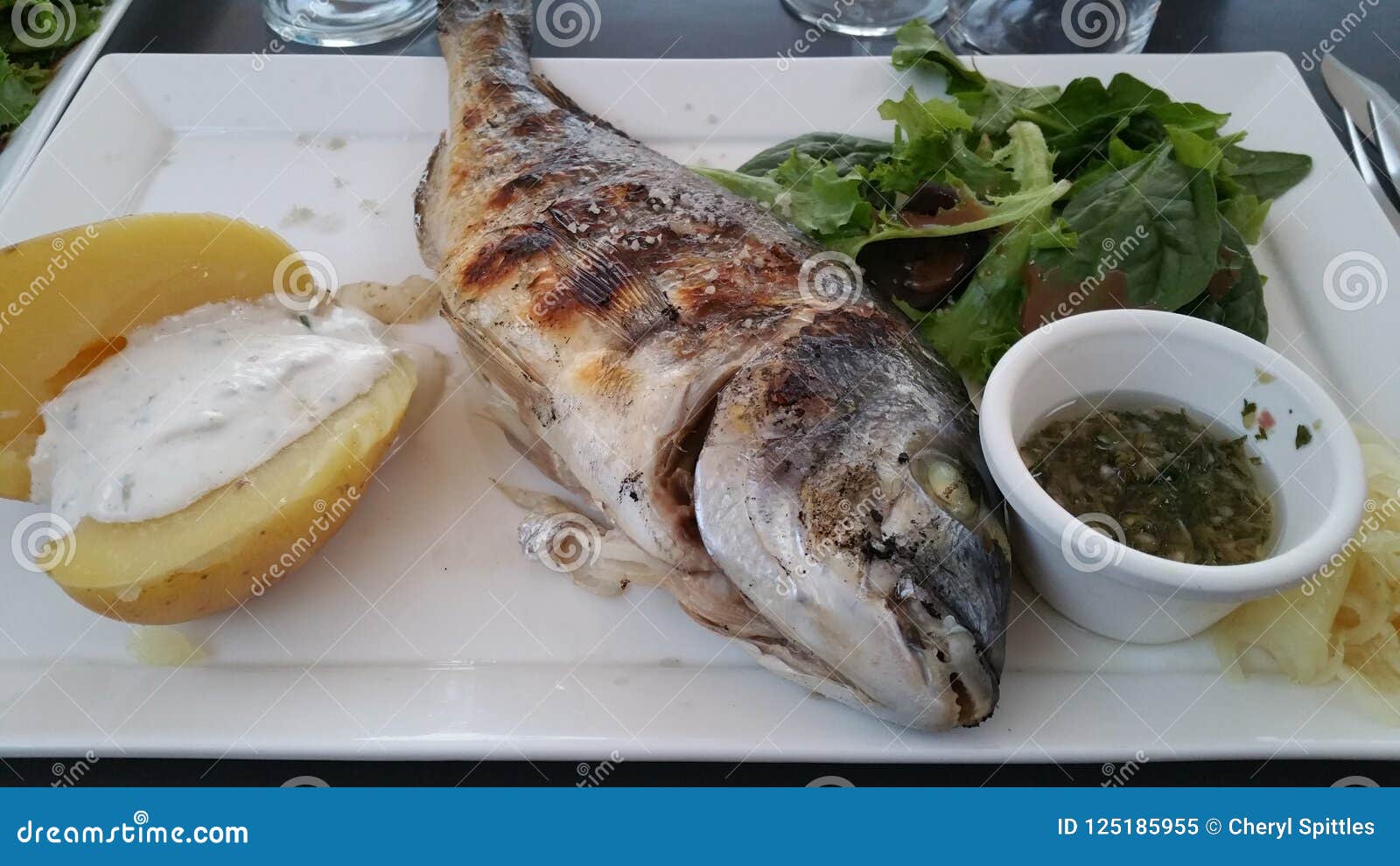 Cooked sea bream stock image. Image of herb, left, chive - 125185955